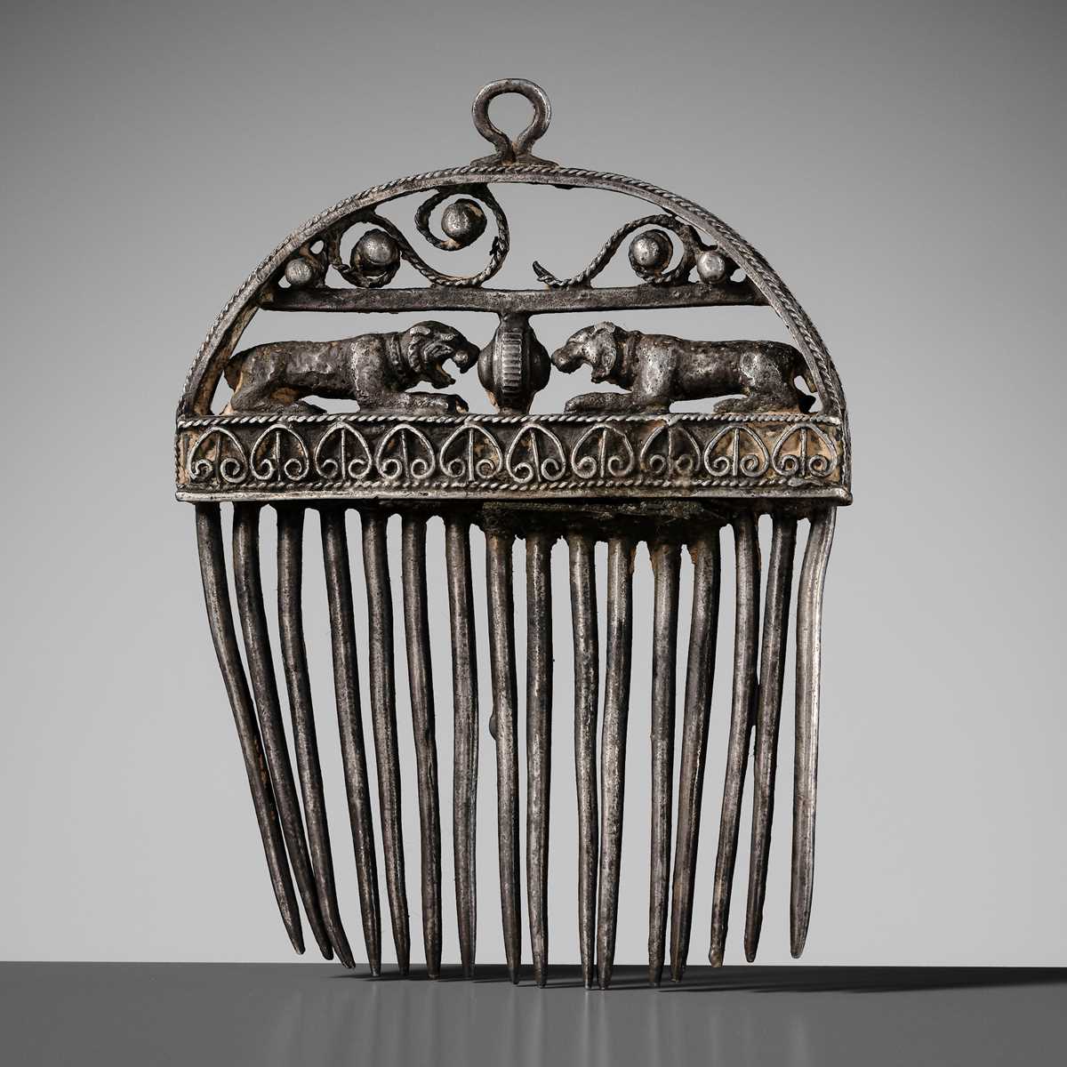Lot 560 - A SILVER ALLOY COMB WITH LIONS, EURASIAN