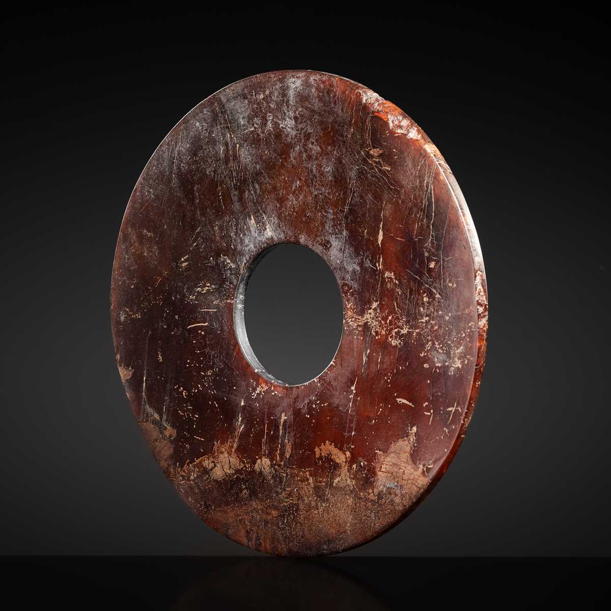 Lot 223 - A REDDISH-BROWN JADE DISK, BI, NEOLITHIC