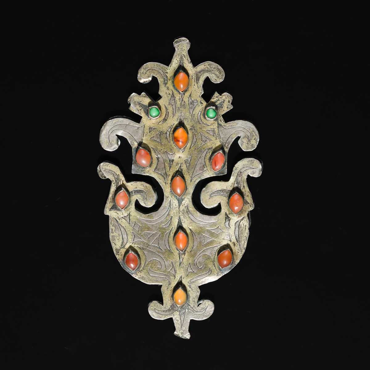 Lot 210 - A TURKMEN CARNELIAN-INLAID PARCEL-GILT METAL