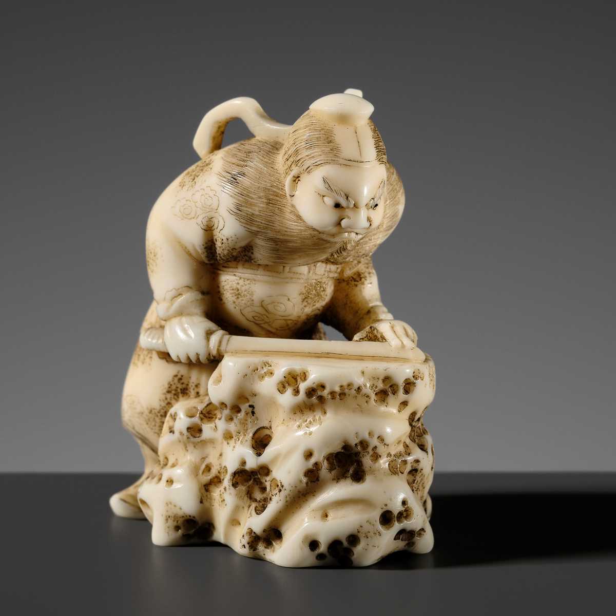 Lot 504 - A FINE WALRUS TUSK NETSUKE OF SHOKI