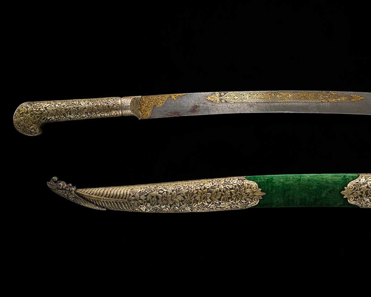 Lot 582 - AN INSCRIBED GOLD-INLAID STEEL SWORD WITH