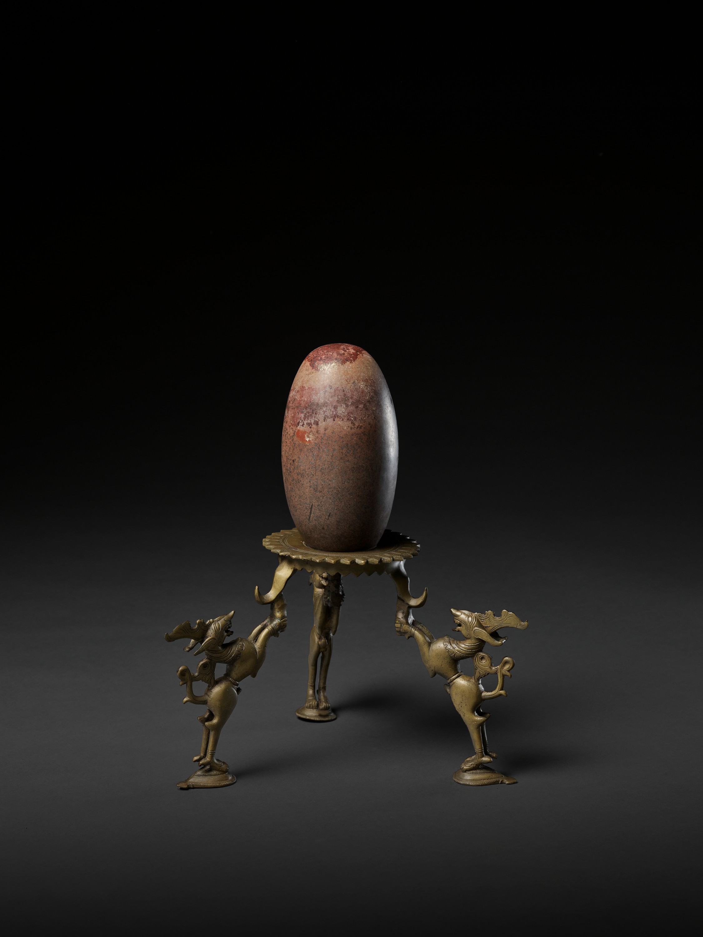 Lot 748 - AN INDIAN STONE BRAHMANDA, ‘COSMIC EGG’, AND