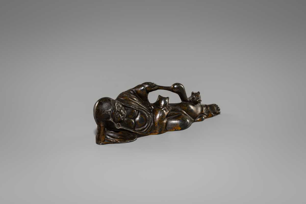 A PATINATED PEWTER OKIMONO OF DARUMA WITH CATS