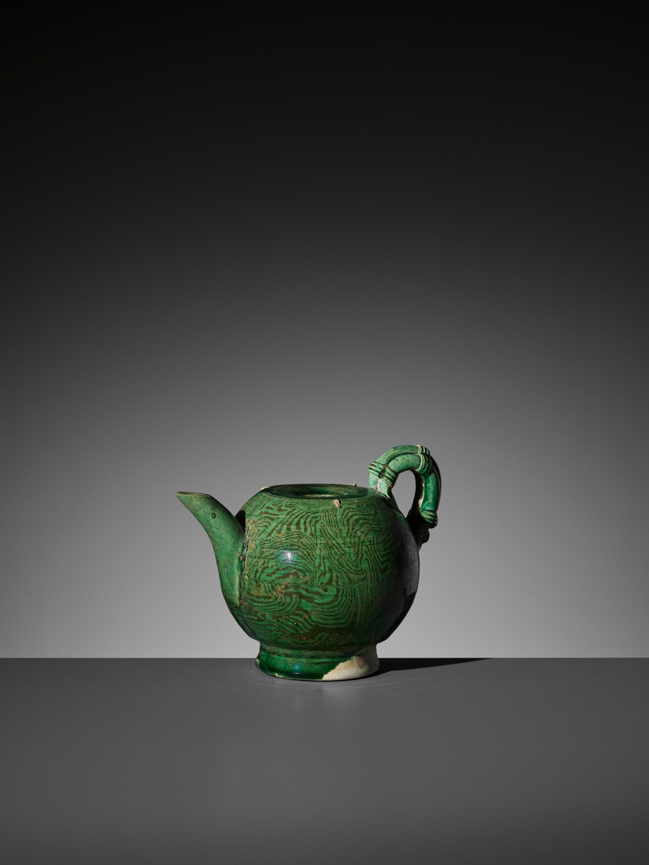 Lot 133 - A GREEN-GLAZED MARBLED TEAPOT, TANG DYNASTY