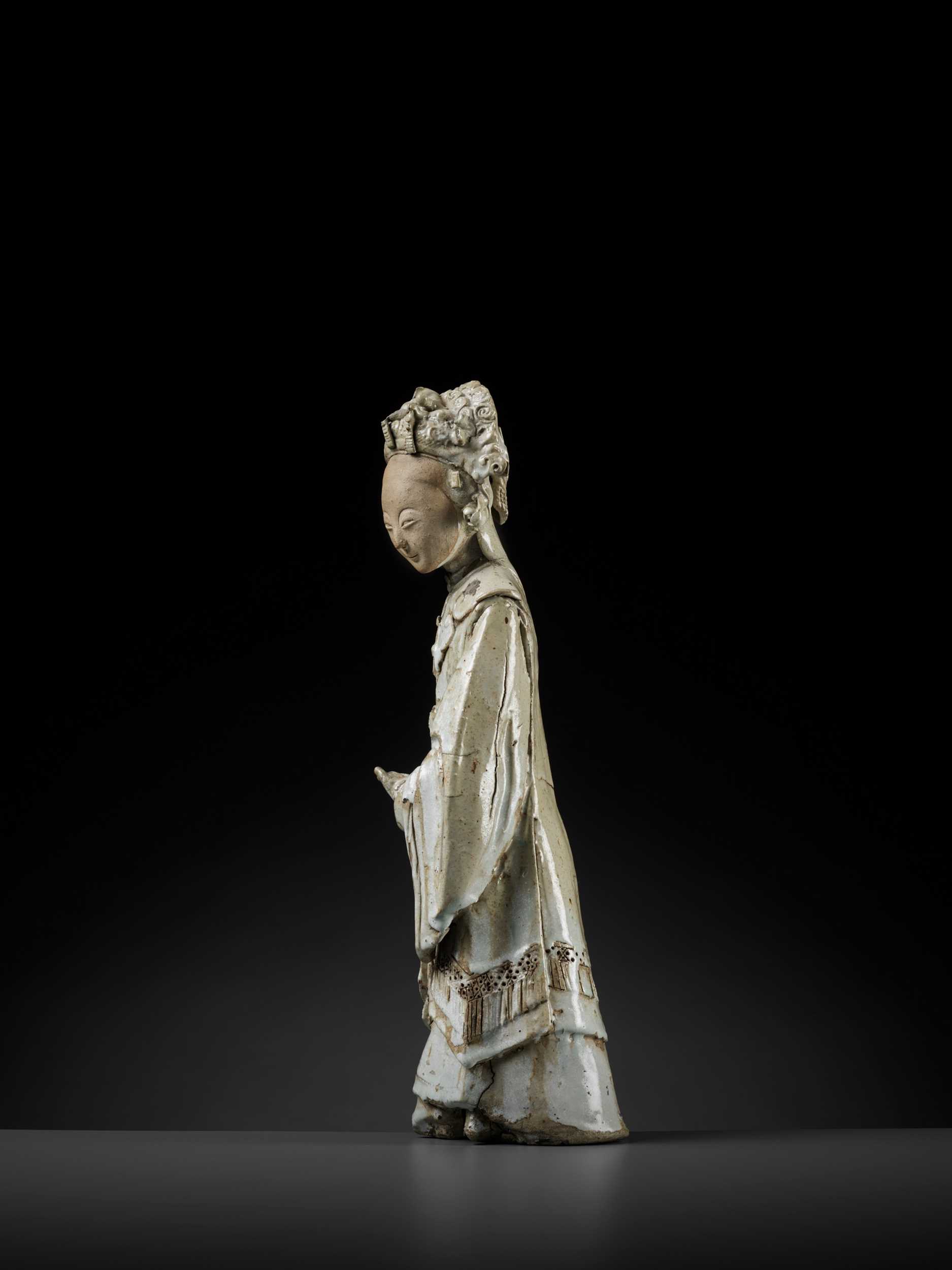 Lot 142 - A QINGBAI FIGURE OF A NOBLE LADY, YUAN