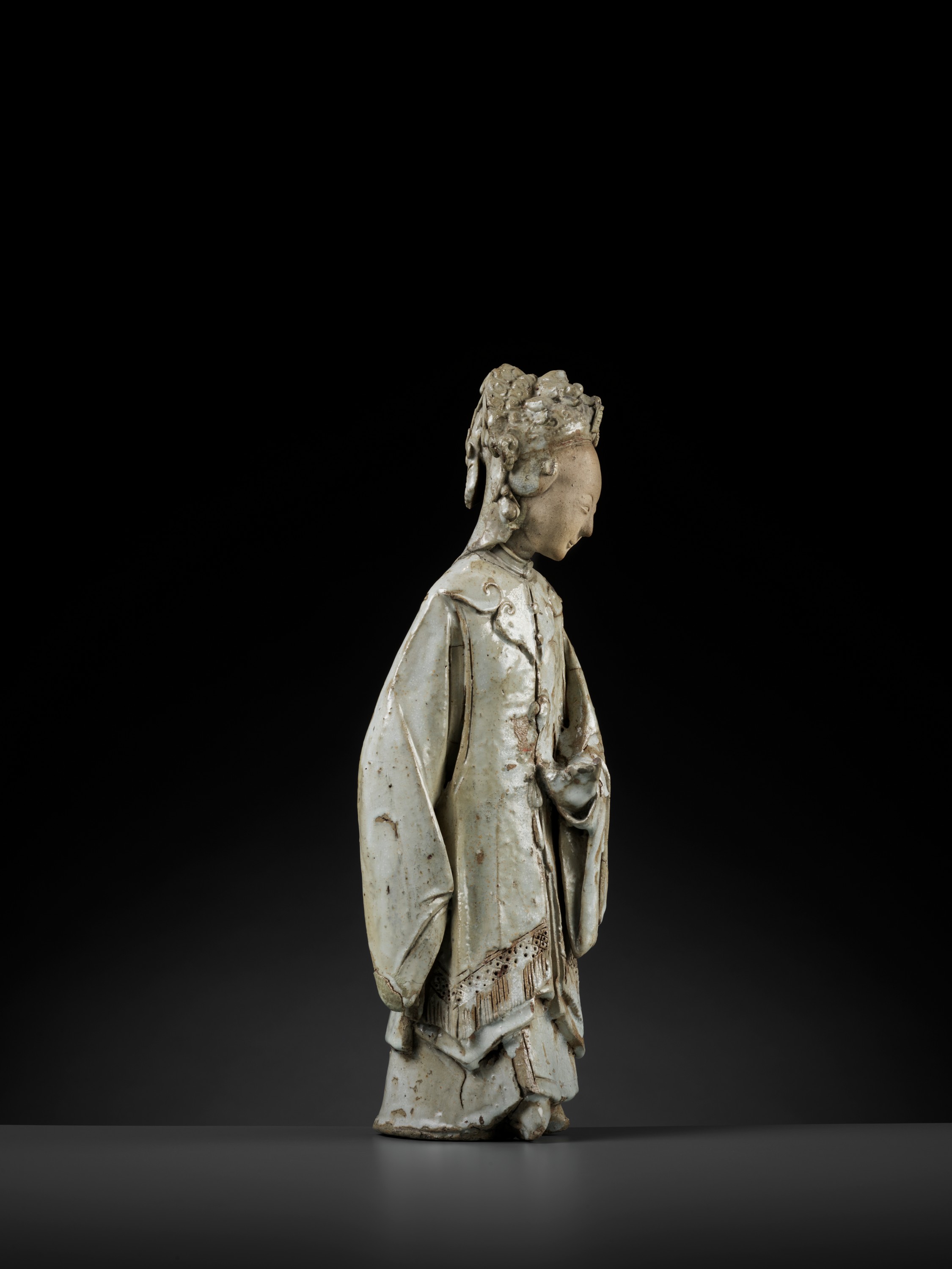 Lot 142 - A QINGBAI FIGURE OF A NOBLE LADY, YUAN