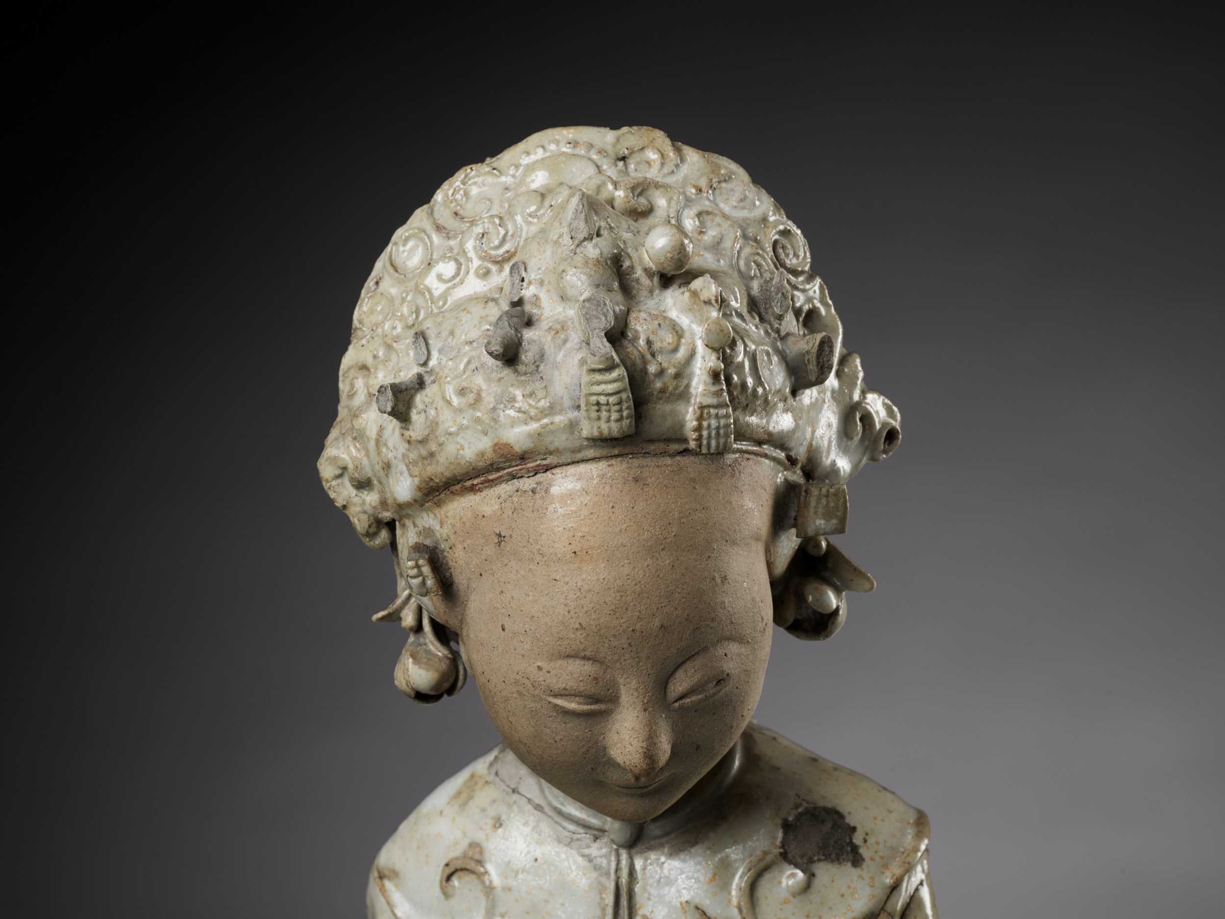 Lot 142 - A QINGBAI FIGURE OF A NOBLE LADY, YUAN