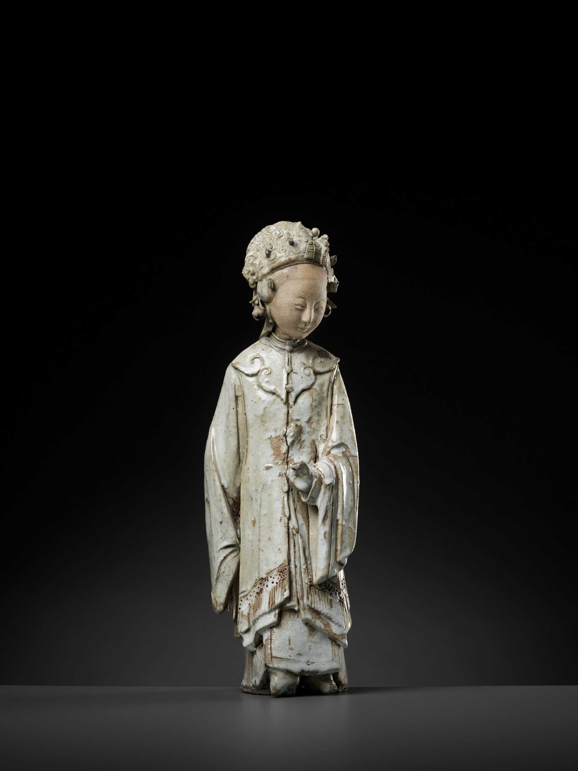 Lot 142 - A QINGBAI FIGURE OF A NOBLE LADY, YUAN