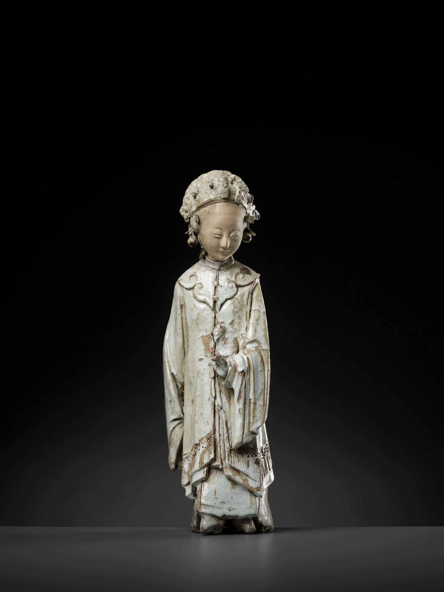Lot 142 - A QINGBAI FIGURE OF A NOBLE LADY, YUAN