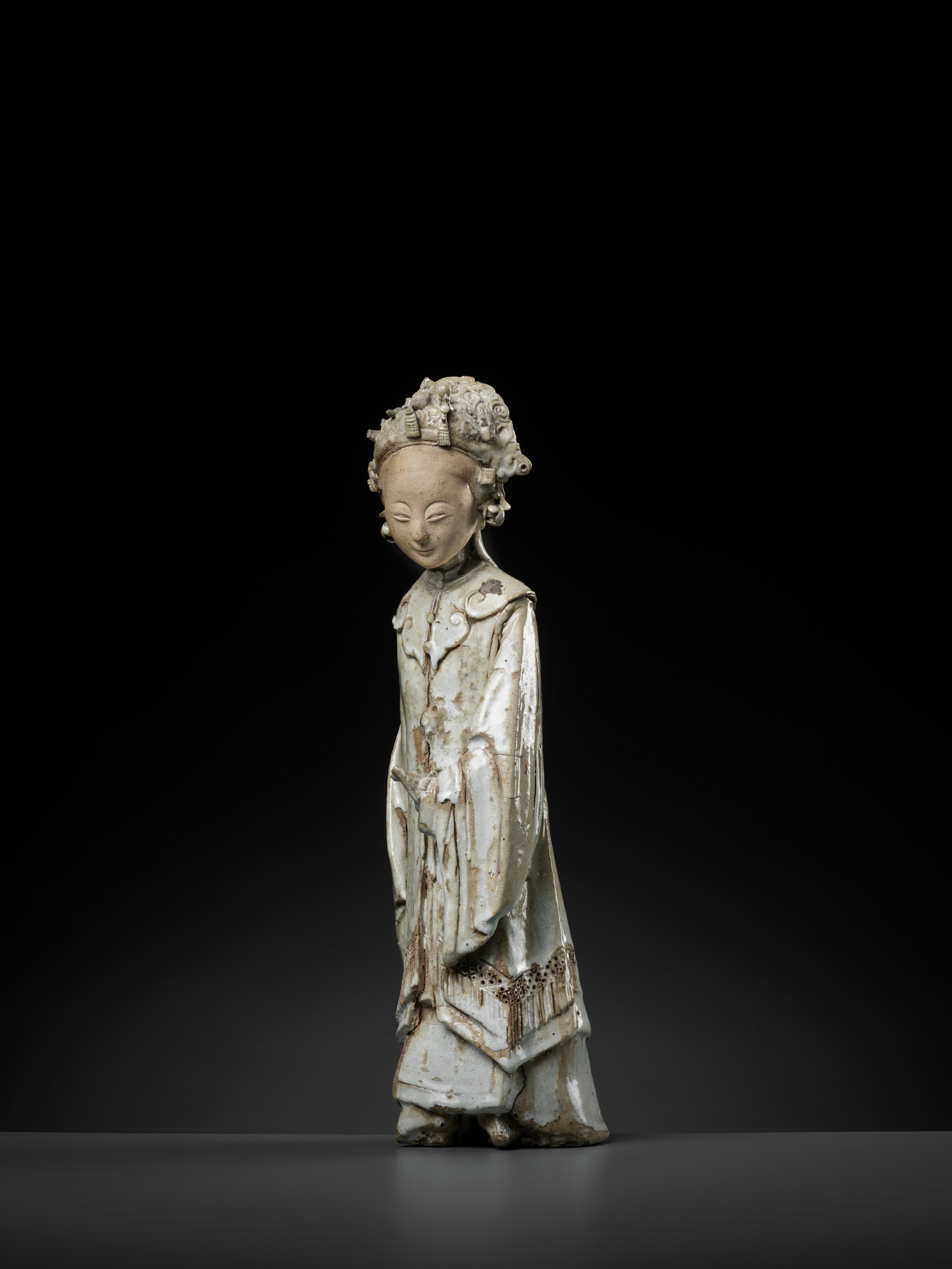 Lot 142 - A QINGBAI FIGURE OF A NOBLE LADY, YUAN