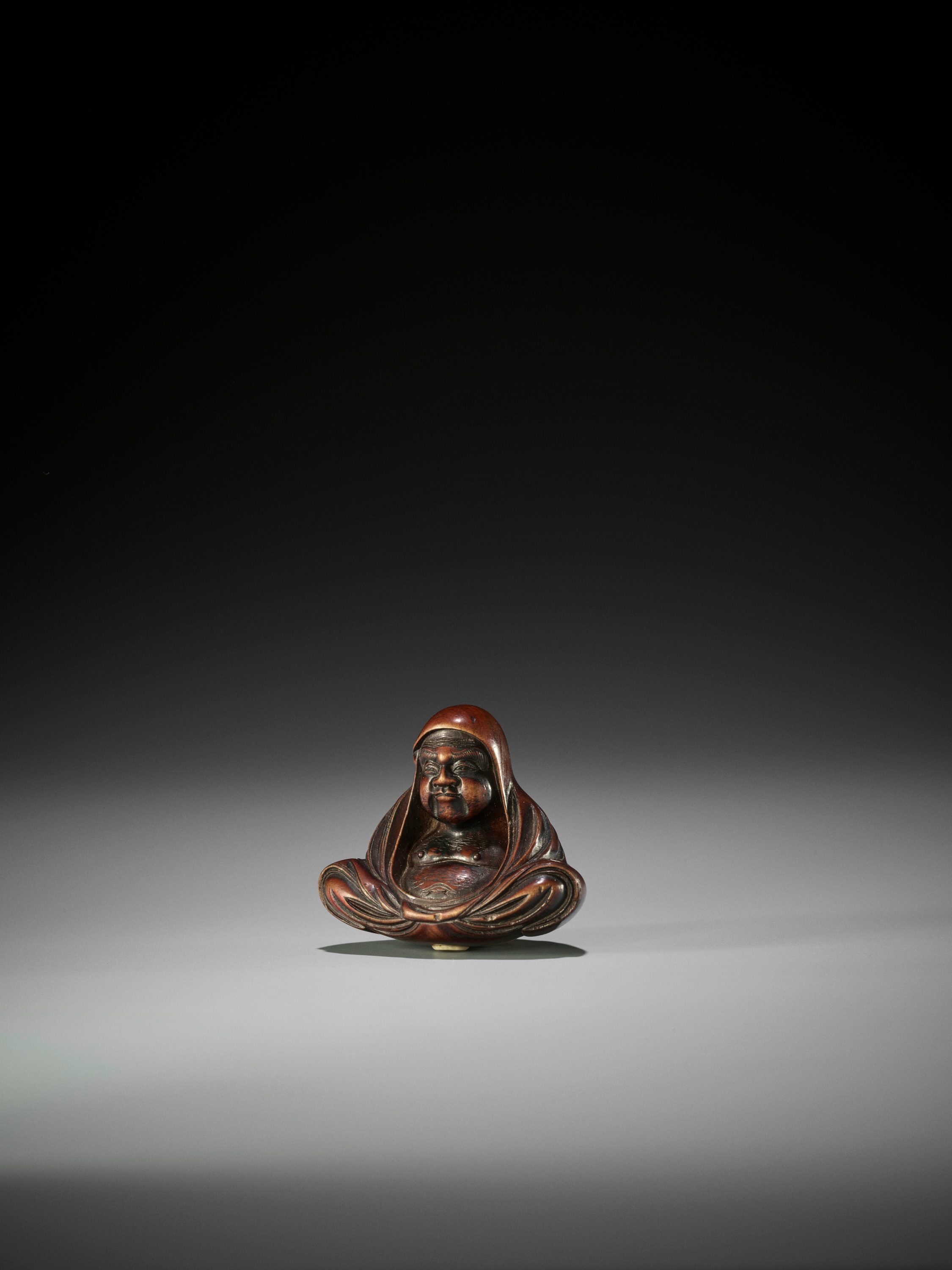 Lot 218 - SHUMIN: A FINE WOOD NETSUKE OF DARUMA