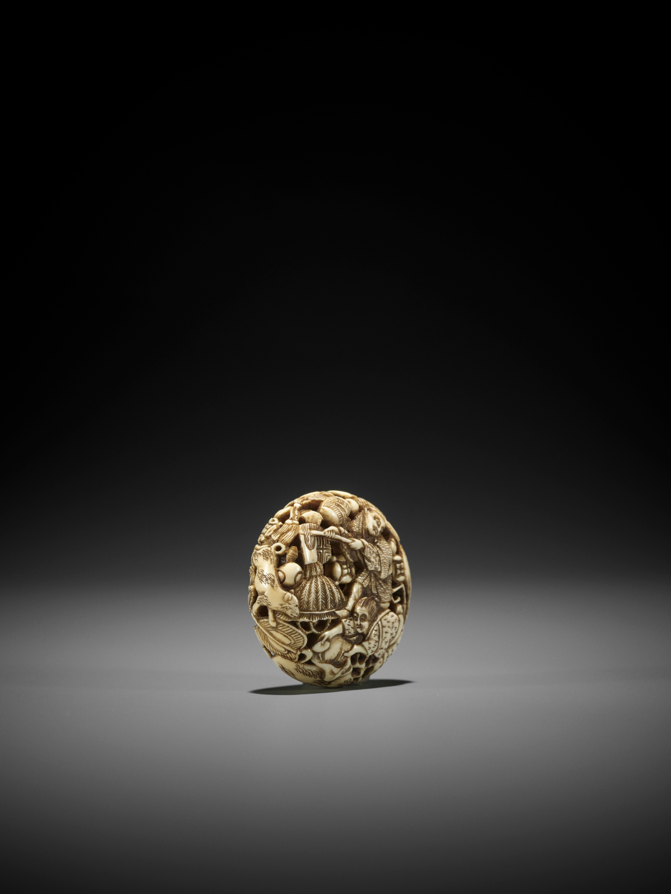 Lot 224 - KOICHI: AN IVORY RYUSA MANJU NETSUKE OF