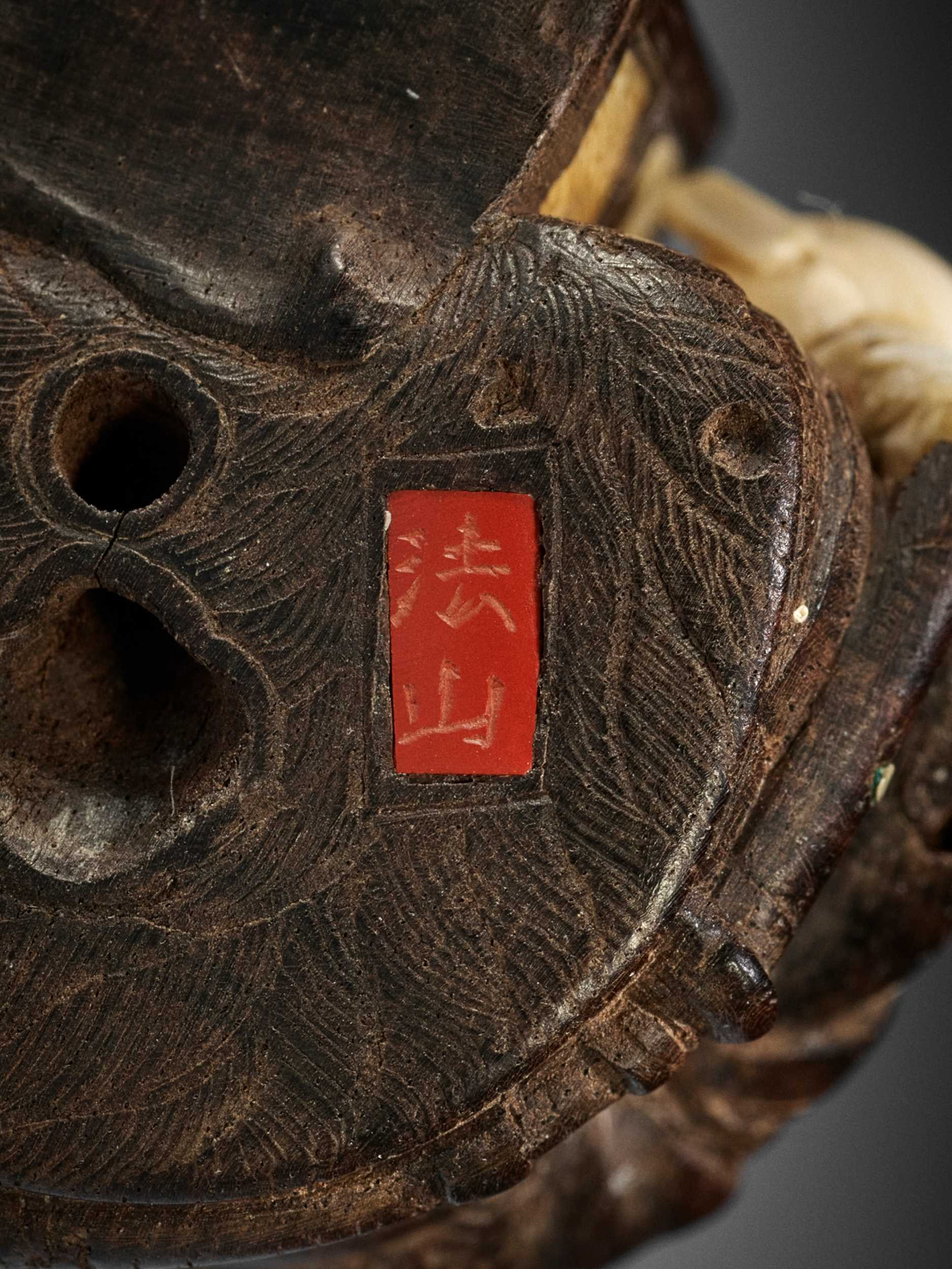 Lot 237 - HOZAN: AN INLAID WOOD NETSUKE OF A YAMABUSHI