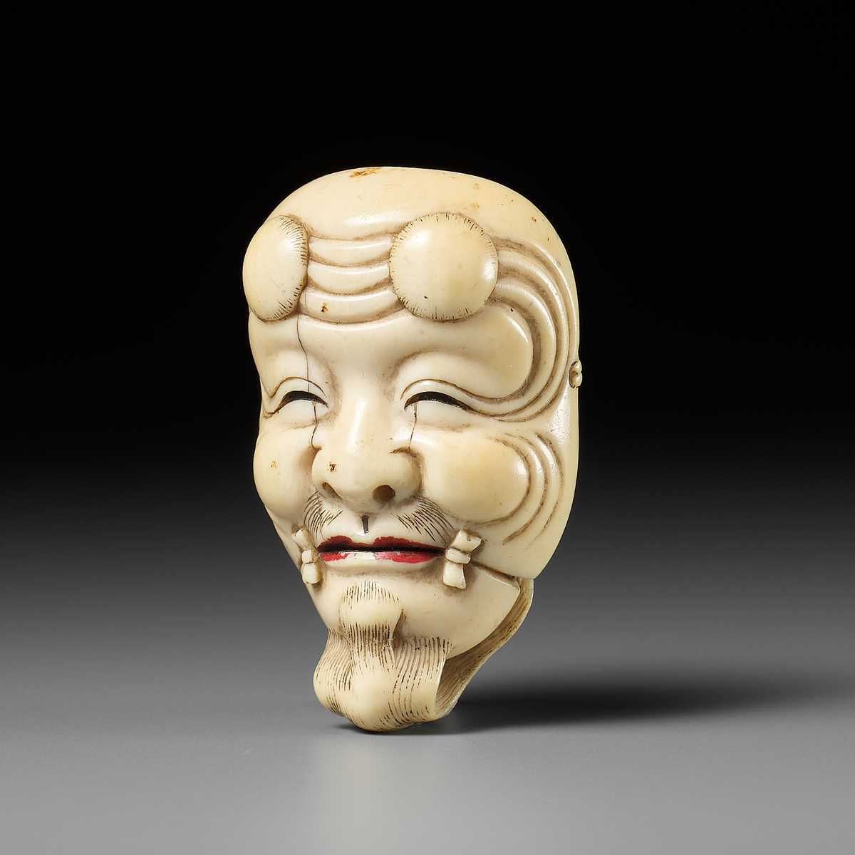 Lot 246 - MEIKEISAI HOJITSU: A FINE IVORY MASK NETSUKE