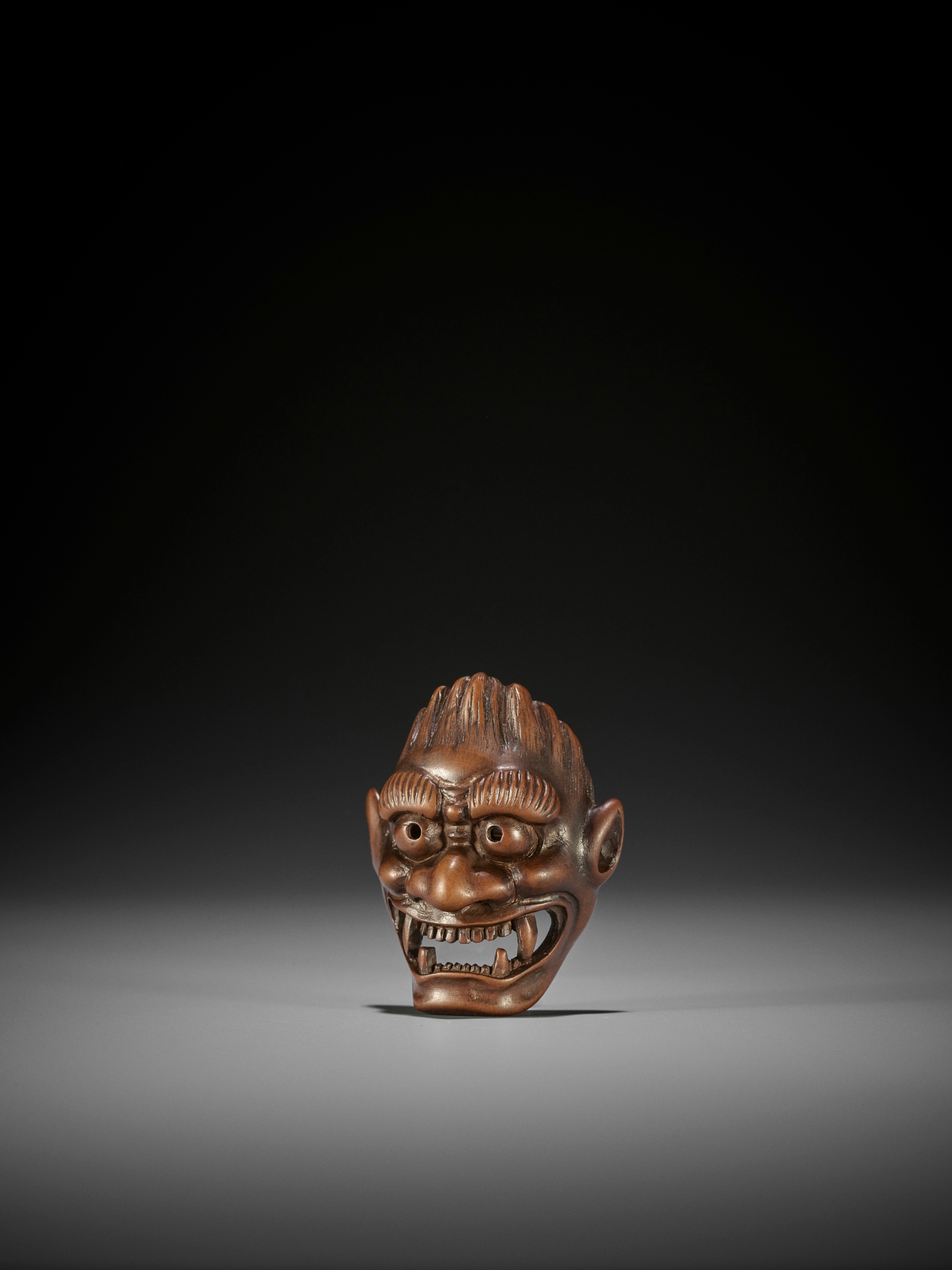 Lot 288 - DEME UMAN: A RARE WOOD MASK NETSUKE OF FUJIN