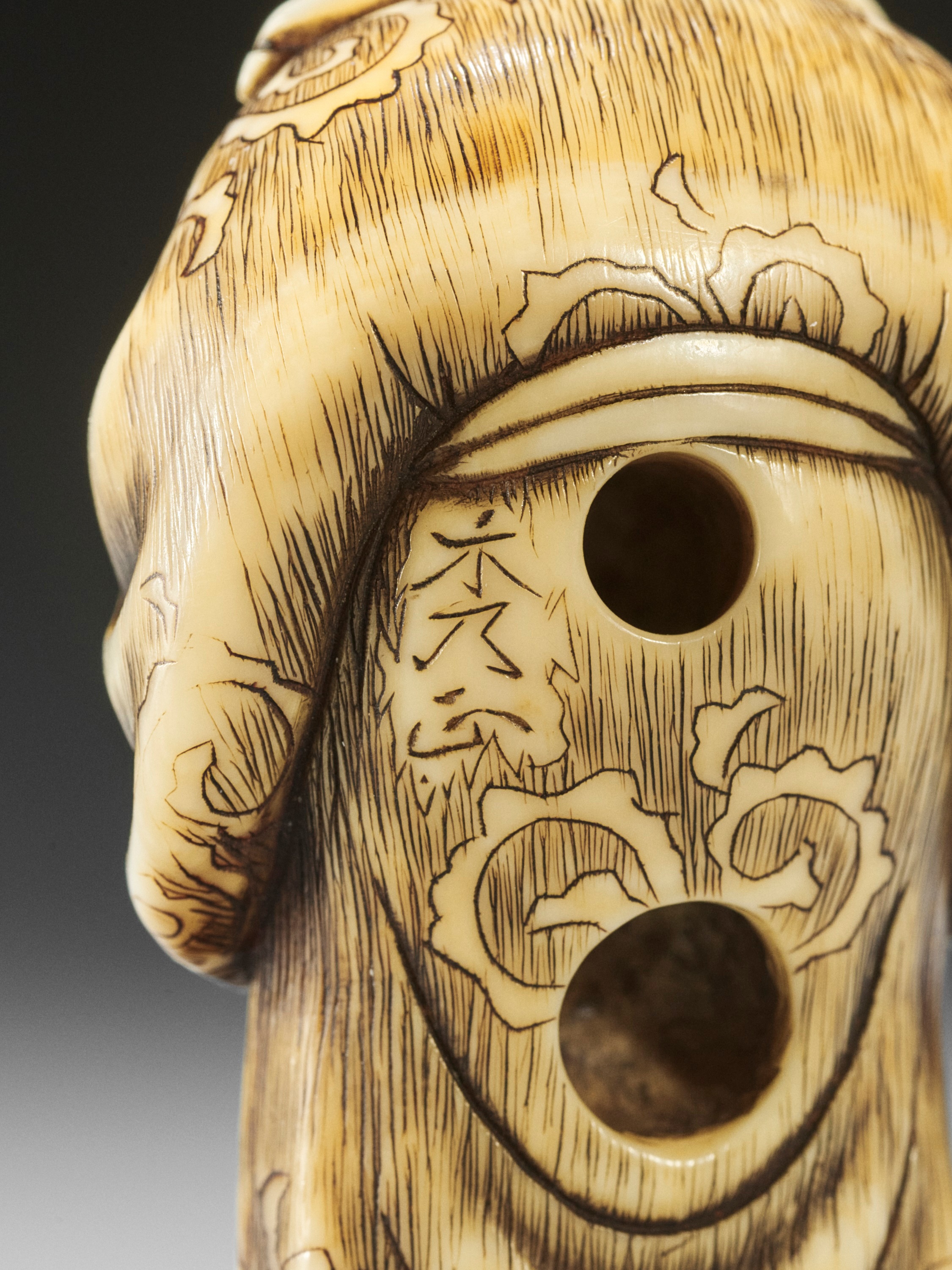 Lot 87 - HIDEMASA: A FINE IVORY NETSUKE OF HOTEI WITH