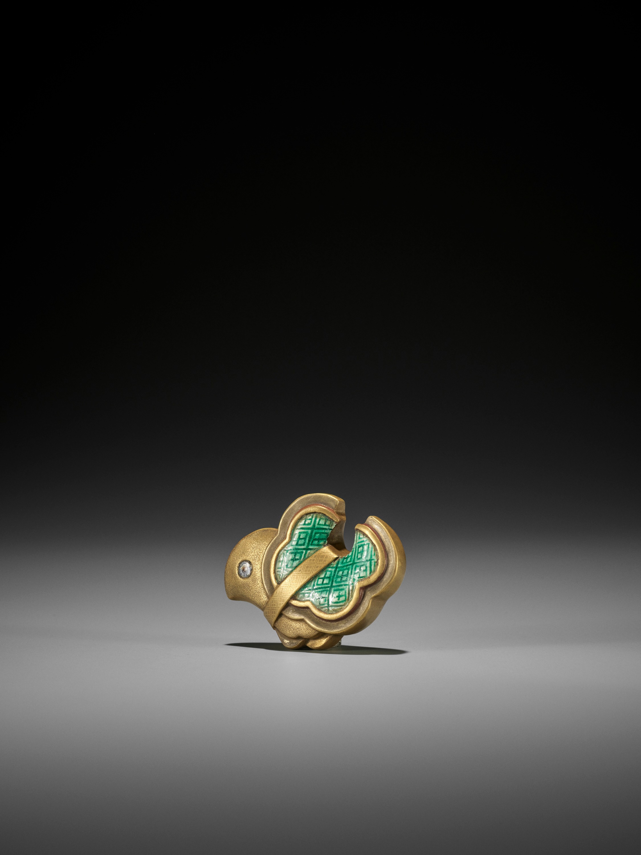 Lot 321 - A RARE LACQUERED AND CERAMIC-INLAID NETSUKE