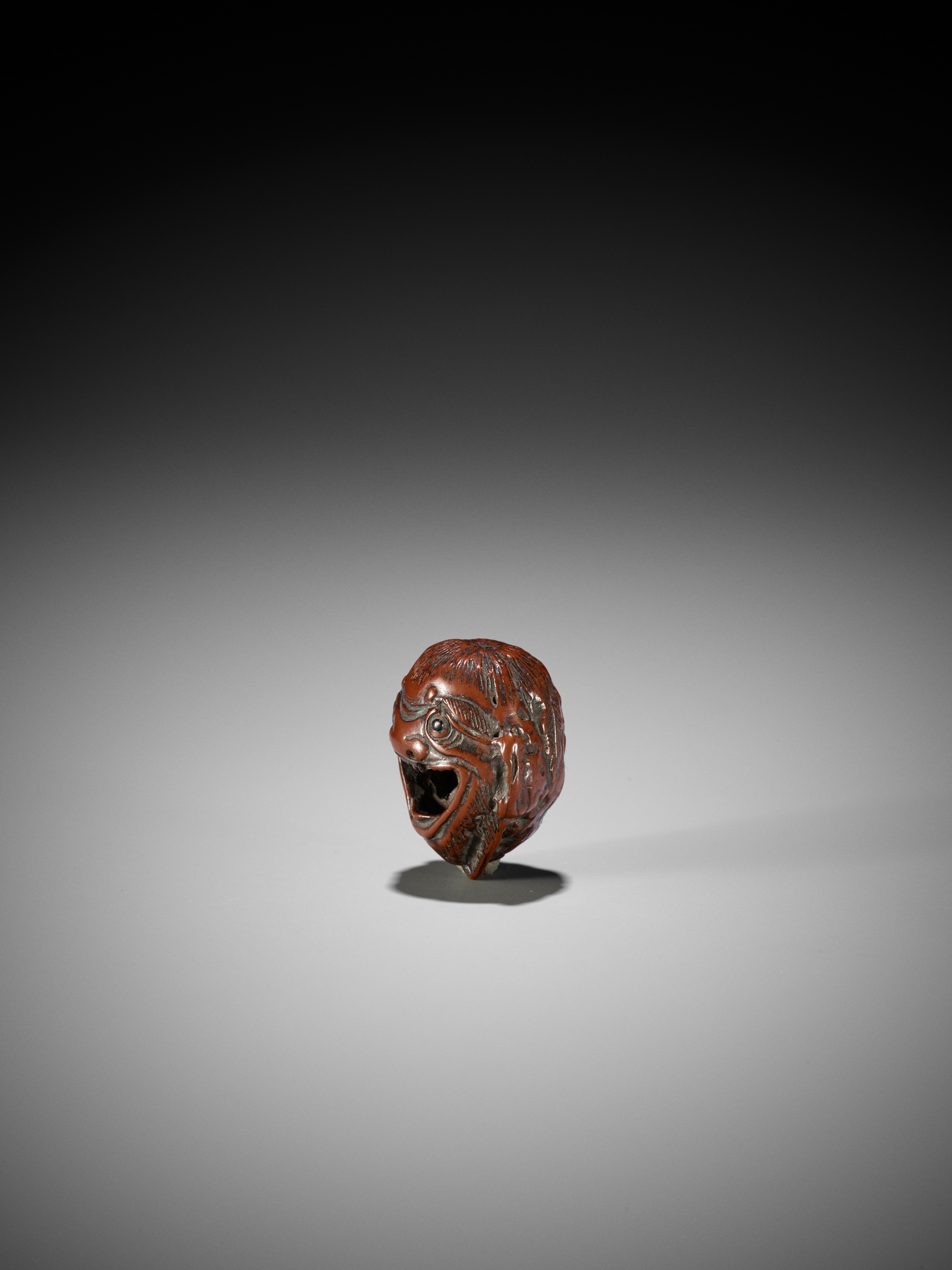Lot 89 - MINRYOSAI: A VERY RARE KURUMI MASK NETSUKE