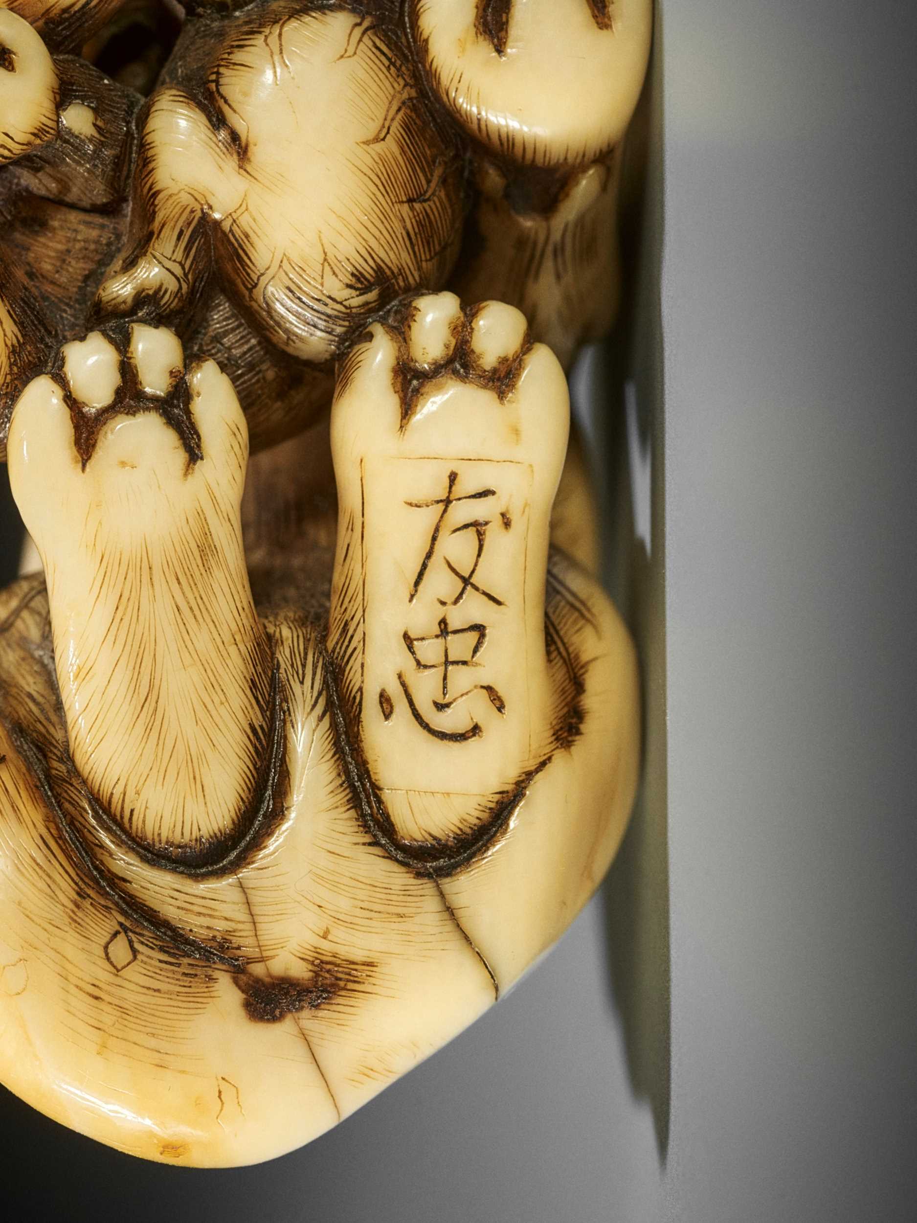 Lot 53 - TOMOTADA: AN EXCEPTIONAL IVORY NETSUKE OF A