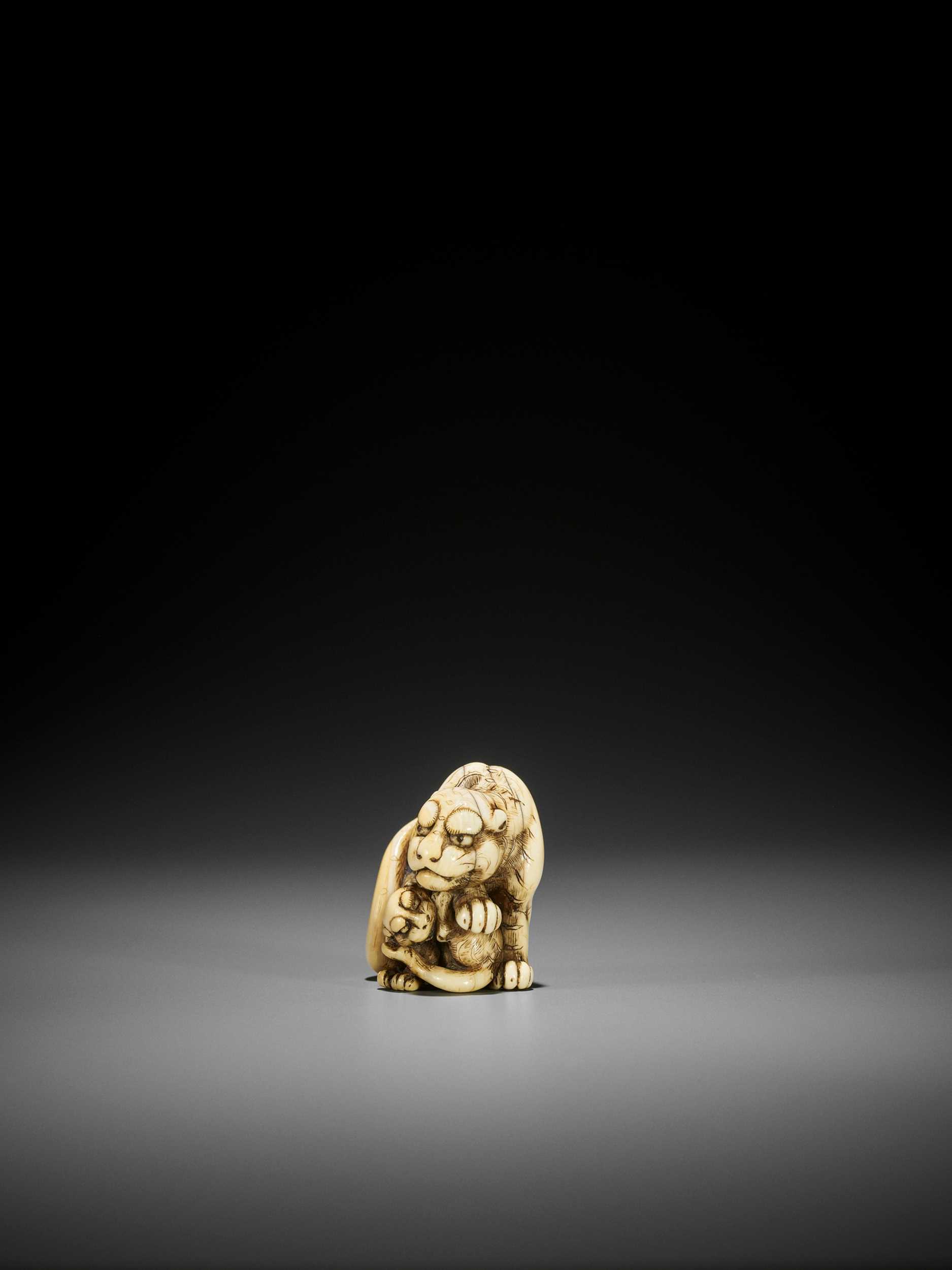 Lot 53 - TOMOTADA: AN EXCEPTIONAL IVORY NETSUKE OF A
