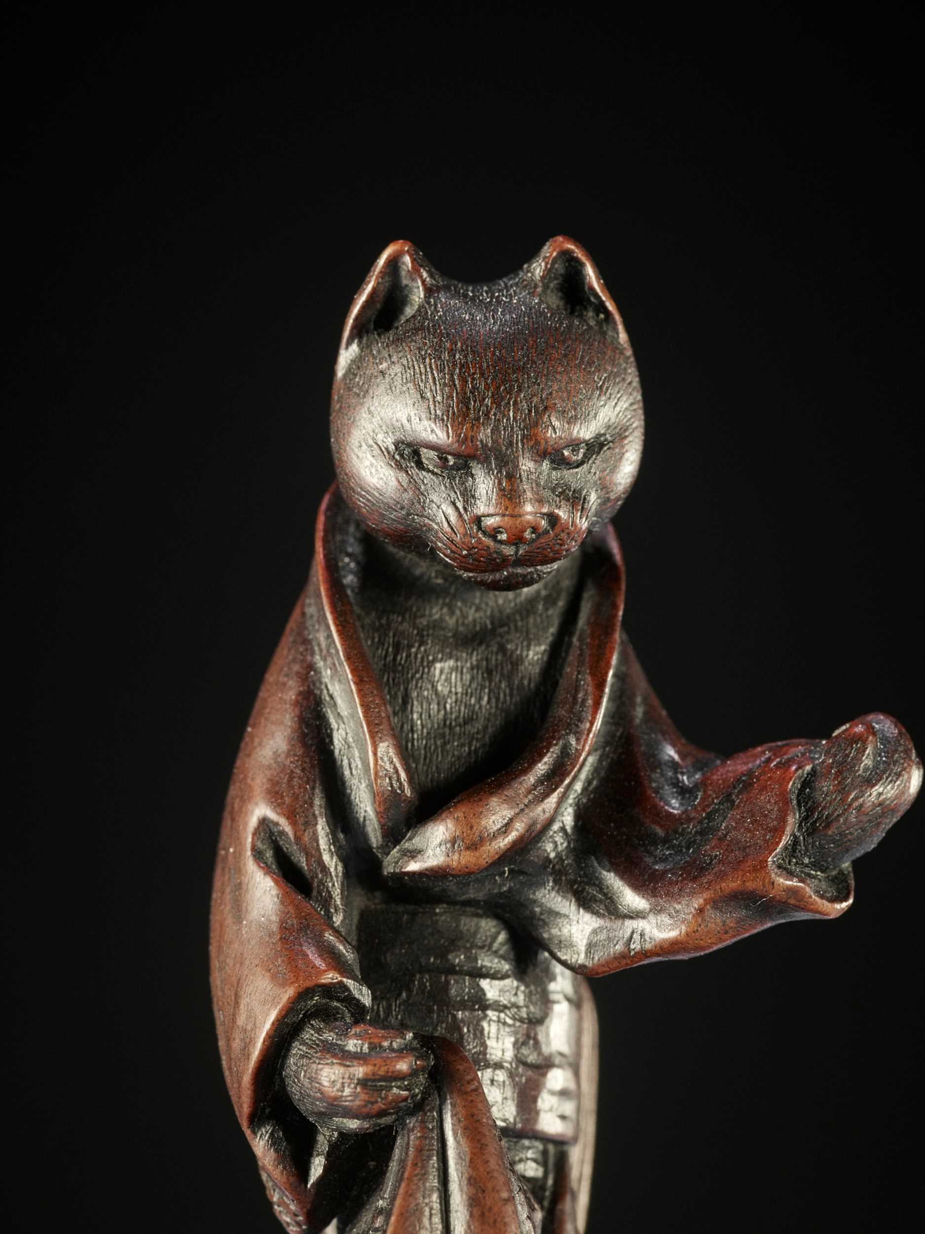 Lot 131 - ITTAN: A RARE WOOD NETSUKE OF A CAT GEISHA