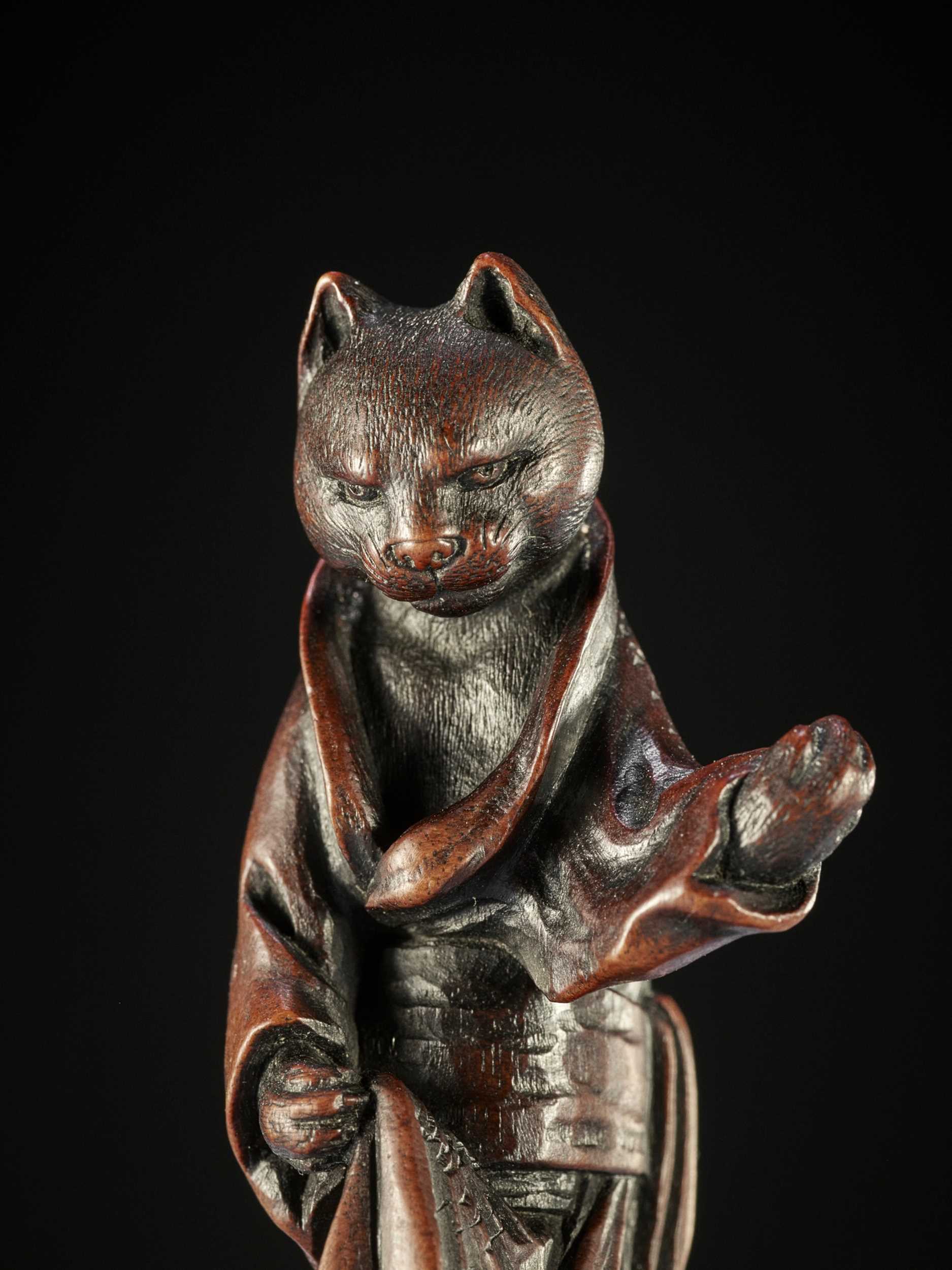 Lot 131 - ITTAN: A RARE WOOD NETSUKE OF A CAT GEISHA