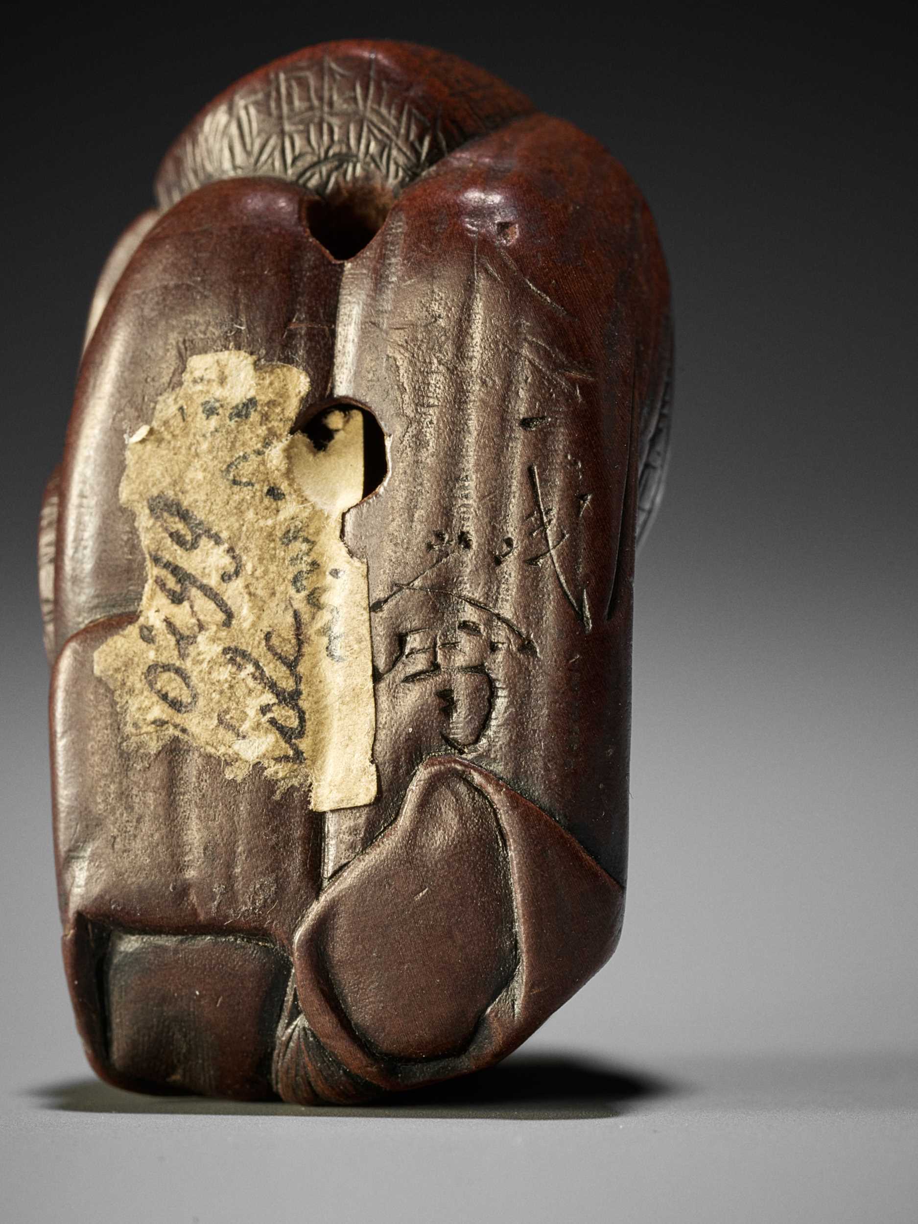 Lot 95 - ICHIMIN: A FINE WOOD SHUNGA NETSUKE OF OKAME