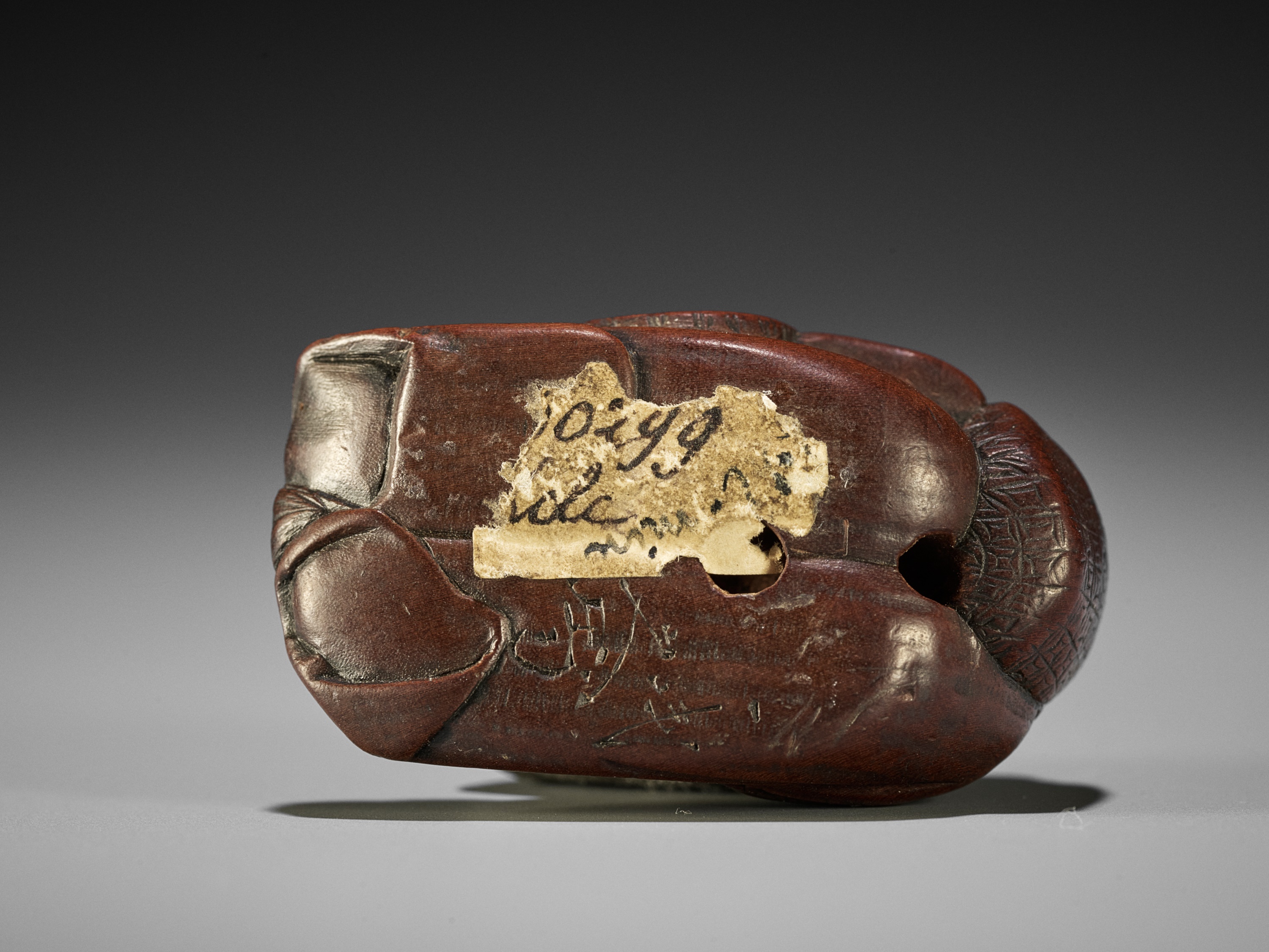 Lot 95 - ICHIMIN: A FINE WOOD SHUNGA NETSUKE OF OKAME