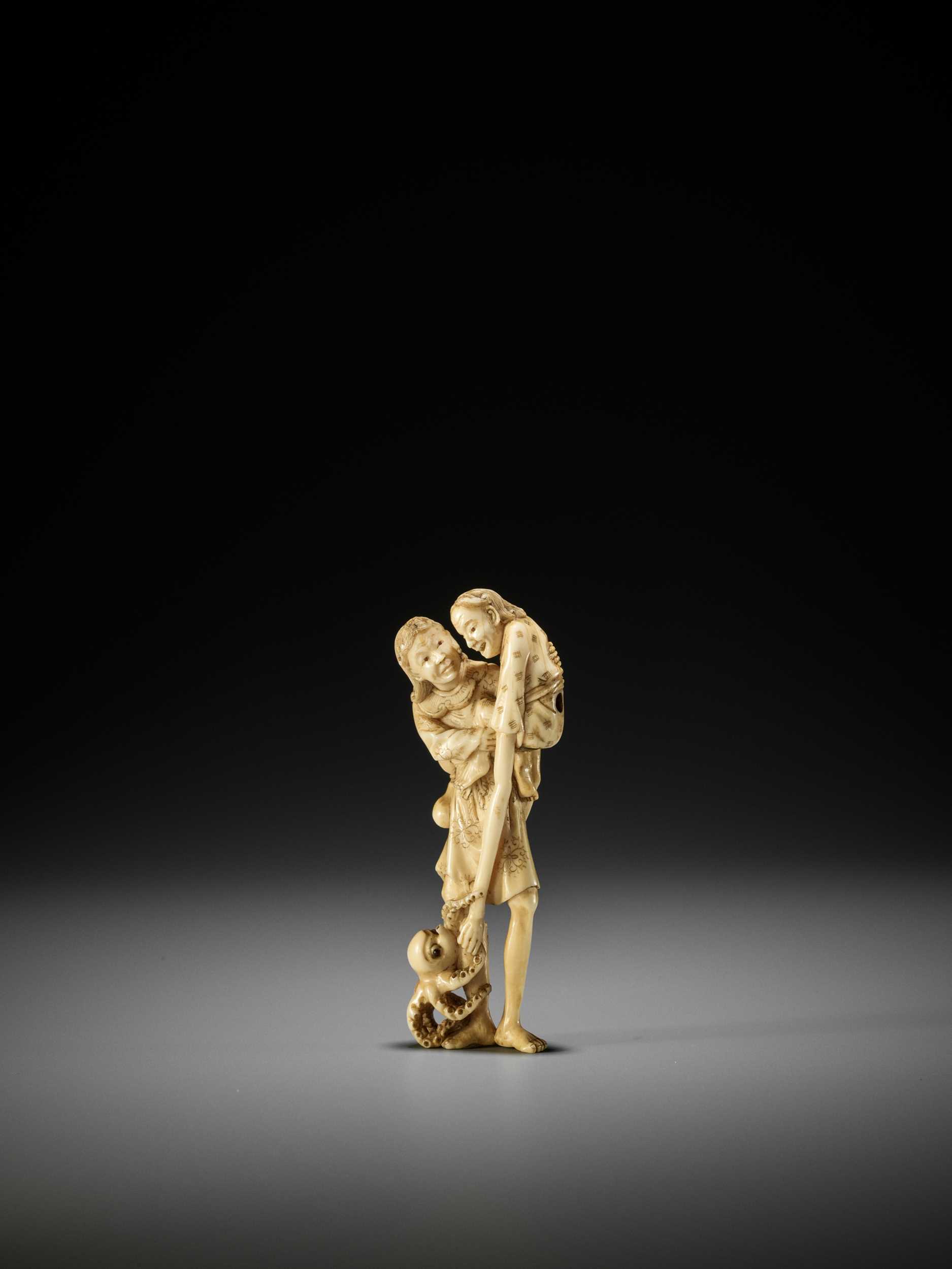 Lot 67 - HIDEMASA: A TALL IVORY NETSUKE OF ASHINAGA