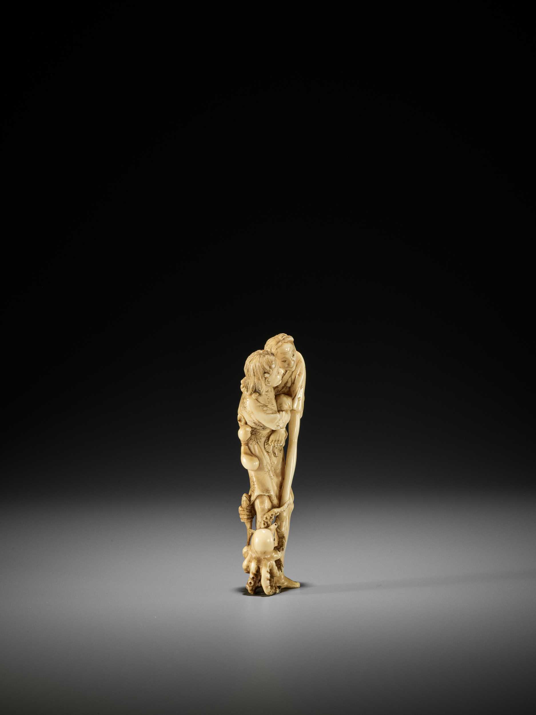Lot 67 - HIDEMASA: A TALL IVORY NETSUKE OF ASHINAGA