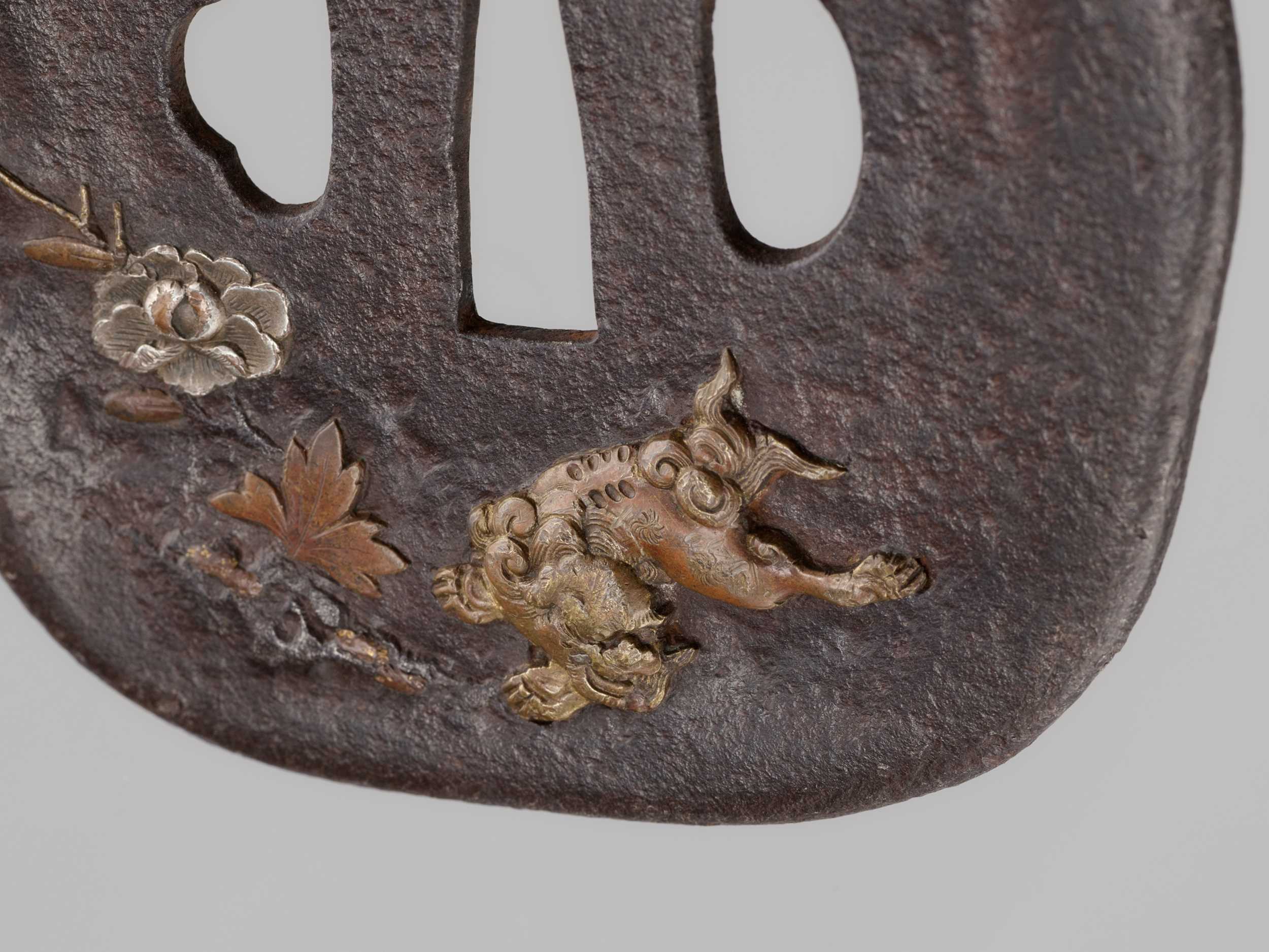 Lot 49 - A VERY LARGE NARA SCHOOL TSUBA WITH SHISHI