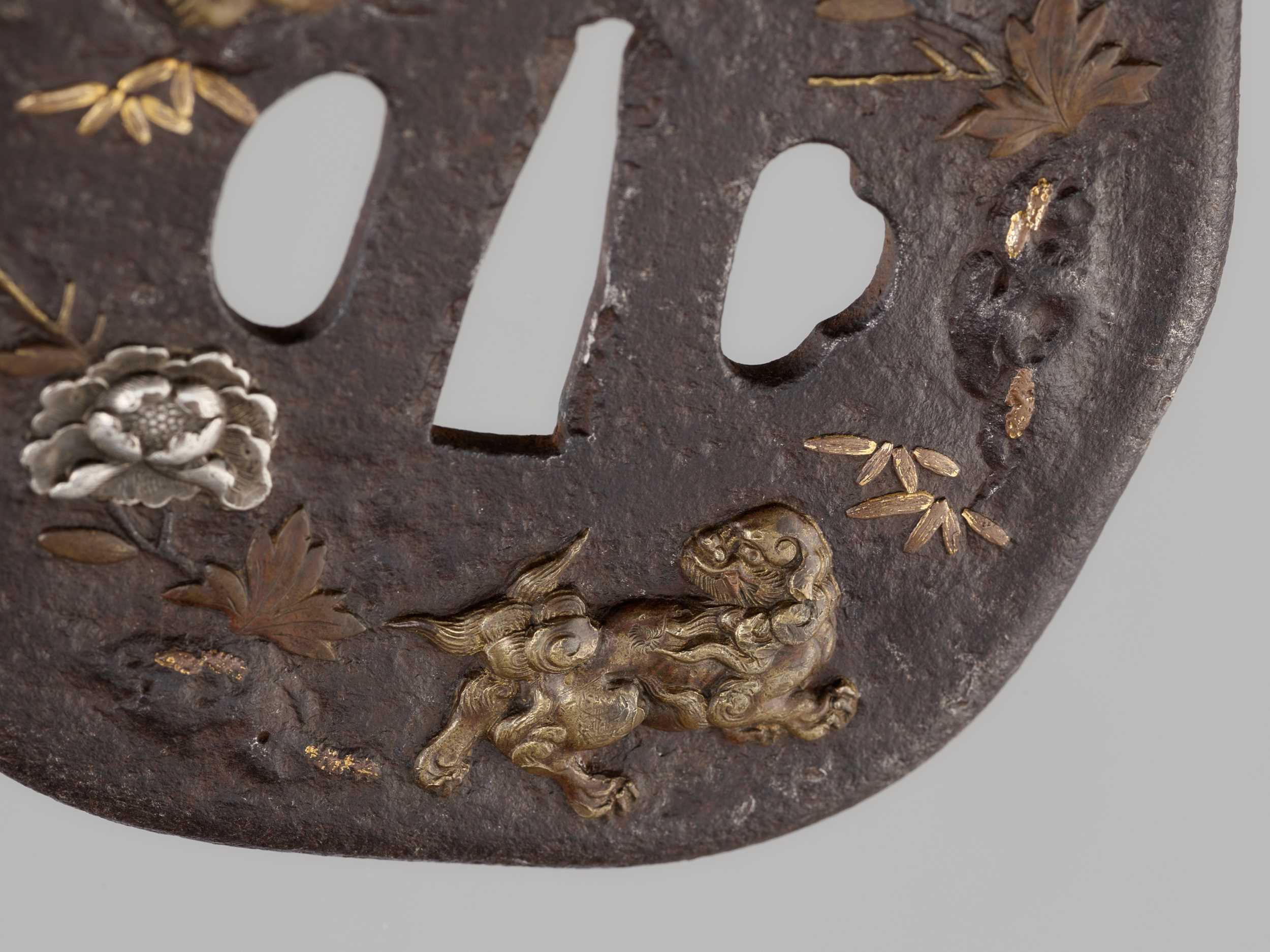 Lot 49 - A VERY LARGE NARA SCHOOL TSUBA WITH SHISHI