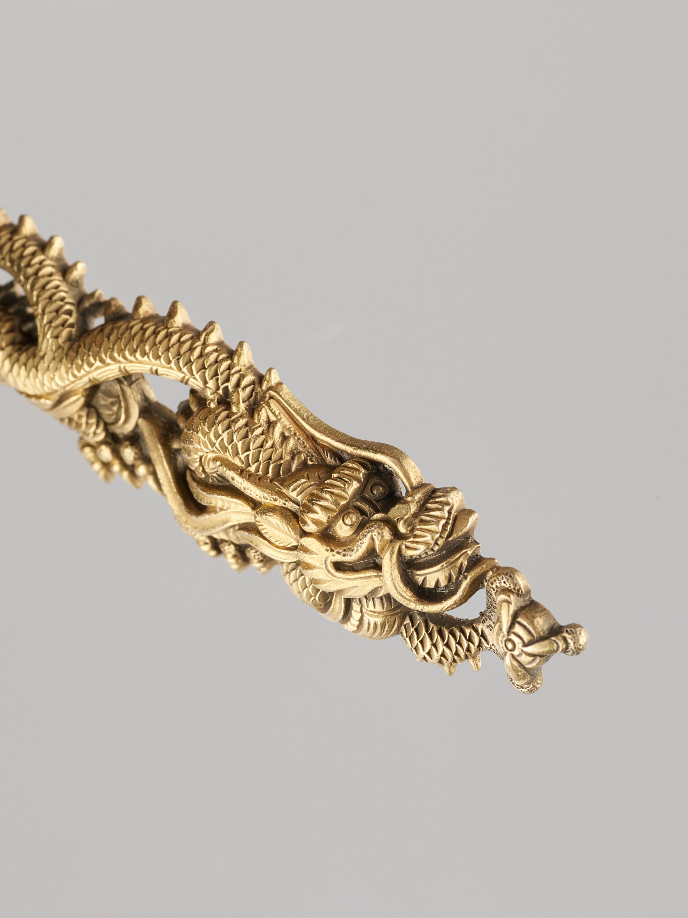 Lot 1353 - A PAIR OF GILT SILVER GOTO SCHOOL DRAGON