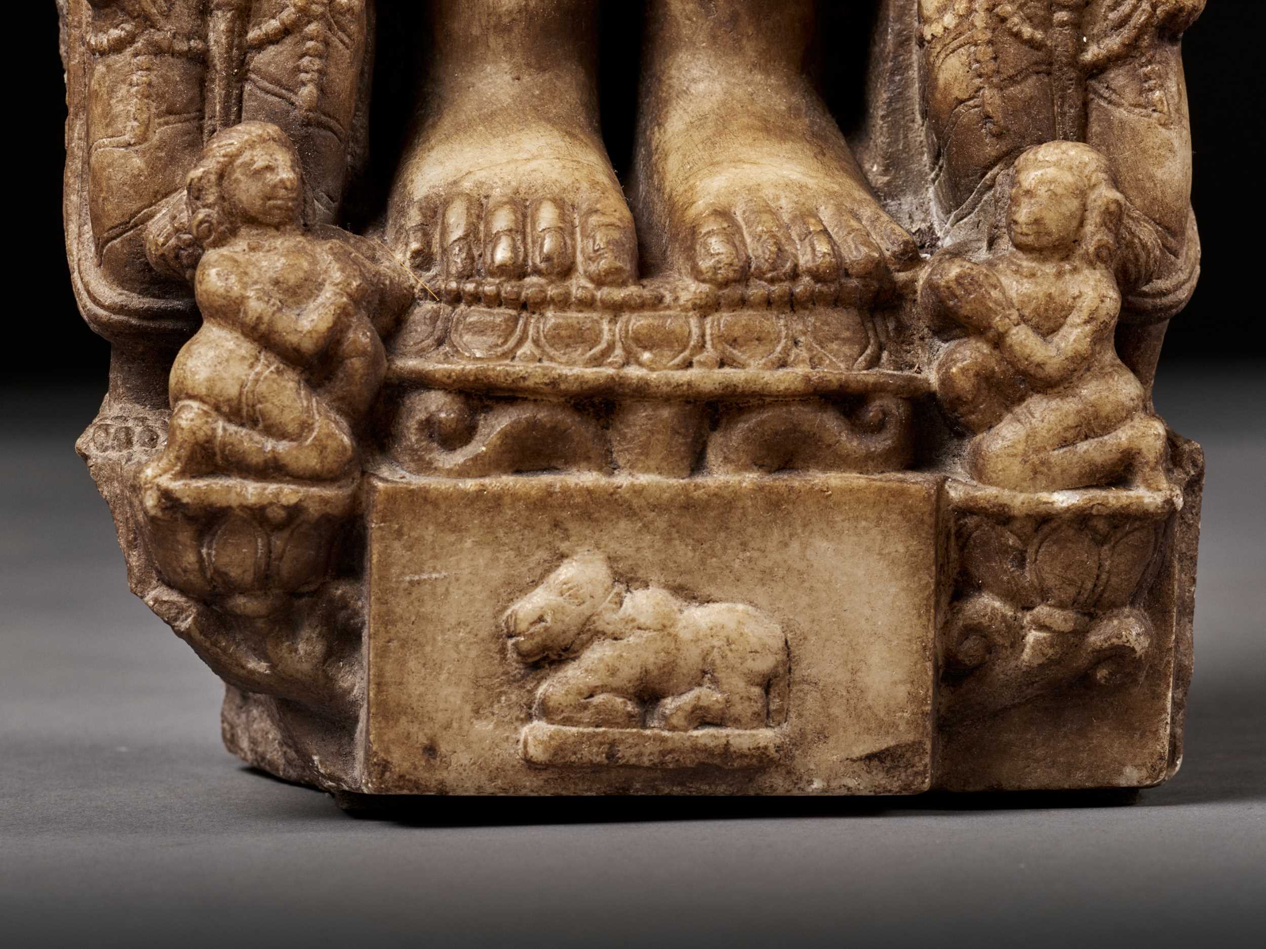 Lot 598 - A JAIN MARBLE FIGURE OF RISHABHANATHA, THE