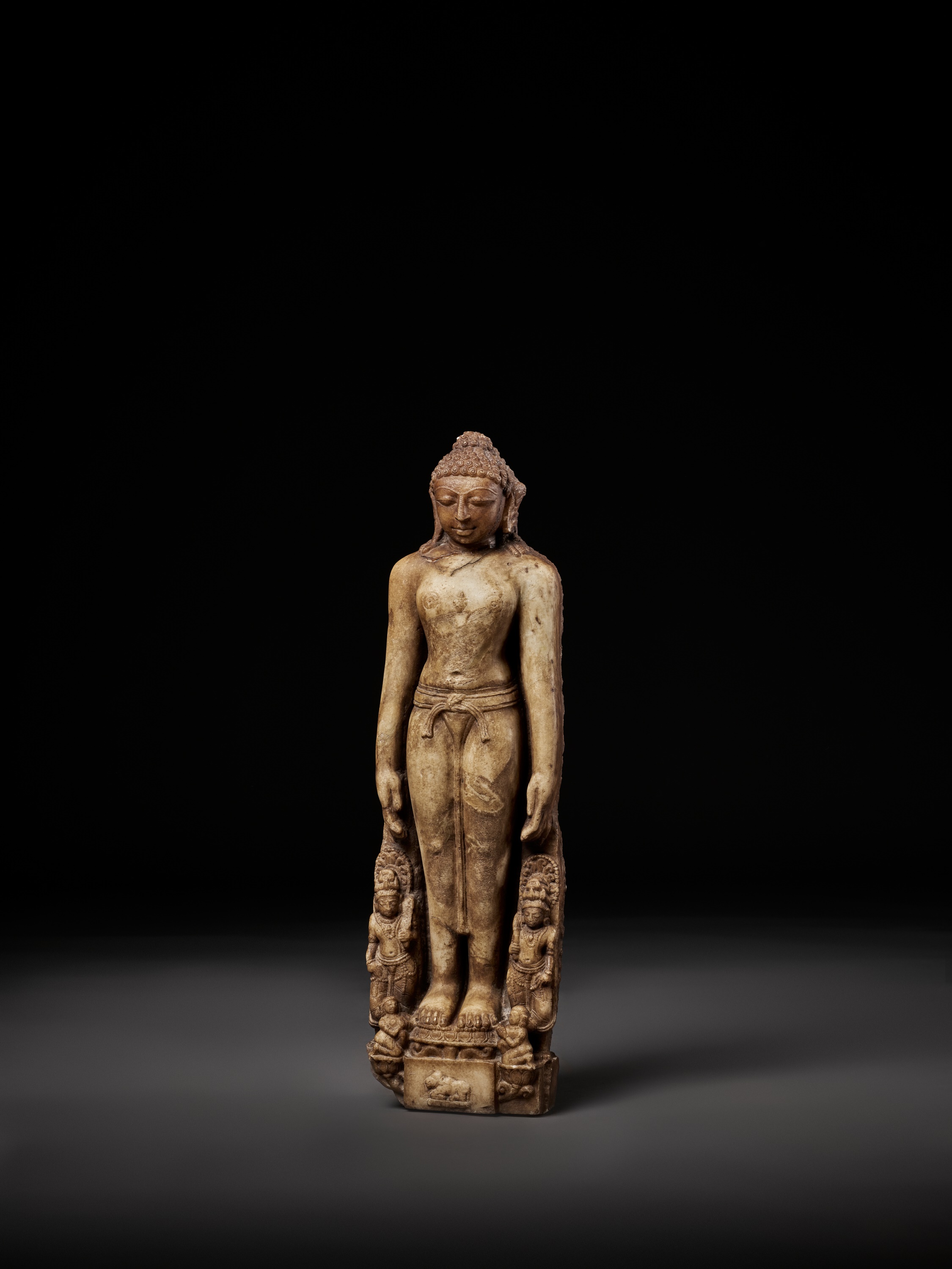 Lot 598 - A JAIN MARBLE FIGURE OF RISHABHANATHA, THE