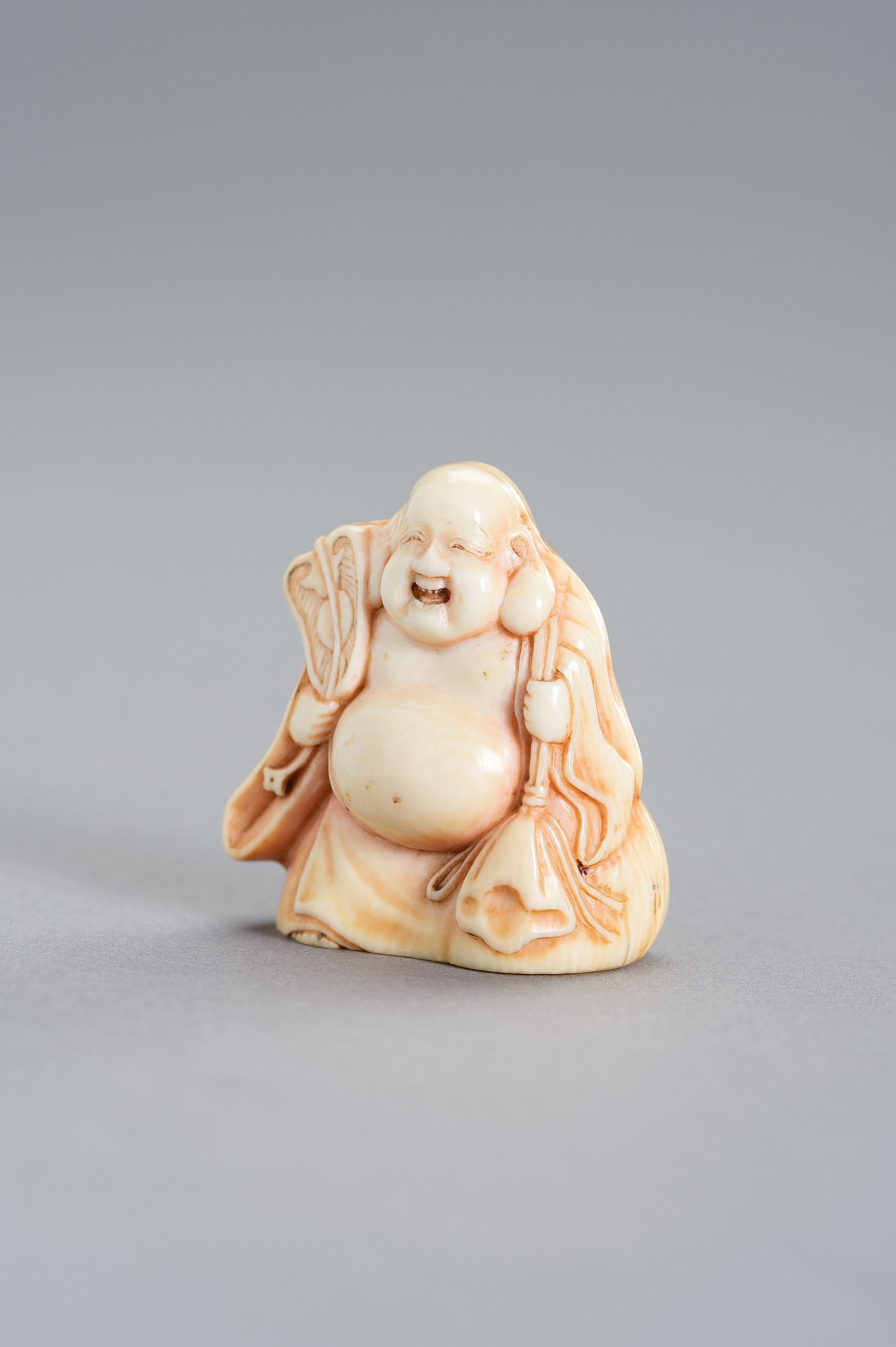 Lot 539 - UEDA KOHOSAI: AN IVORY NETSUKE OF A BIZEN