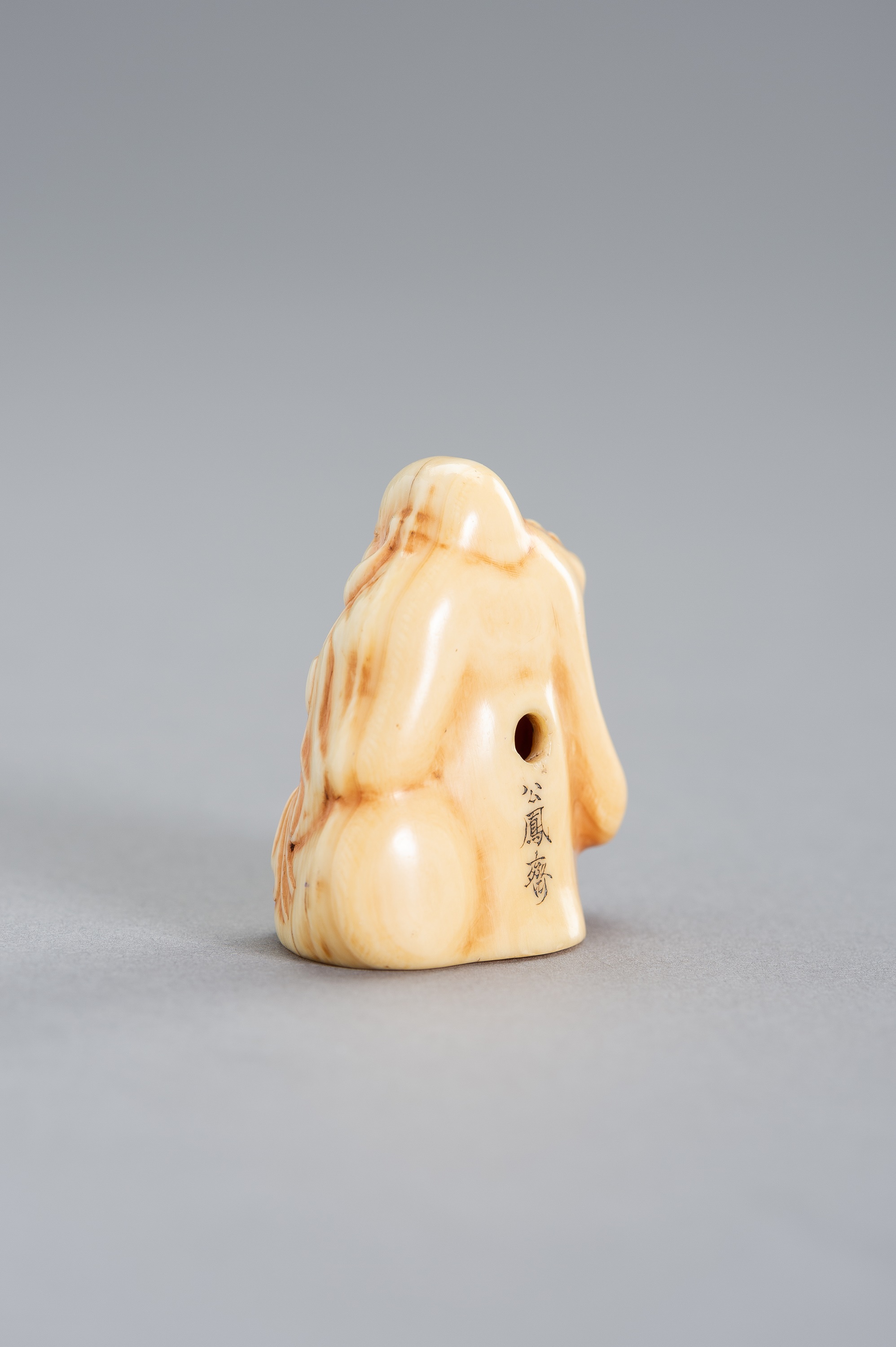 Lot 539 - UEDA KOHOSAI: AN IVORY NETSUKE OF A BIZEN