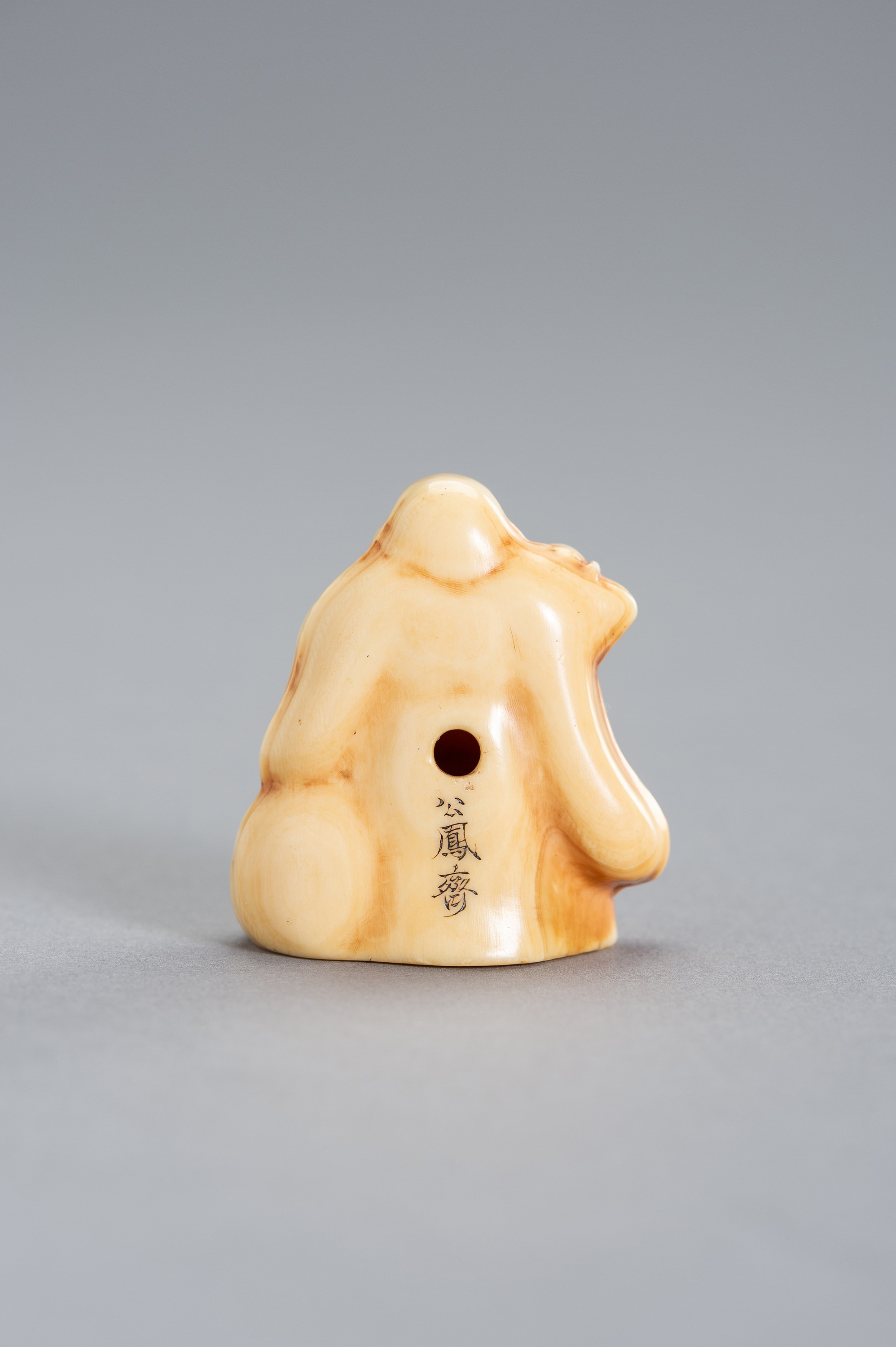 Lot 539 - UEDA KOHOSAI: AN IVORY NETSUKE OF A BIZEN