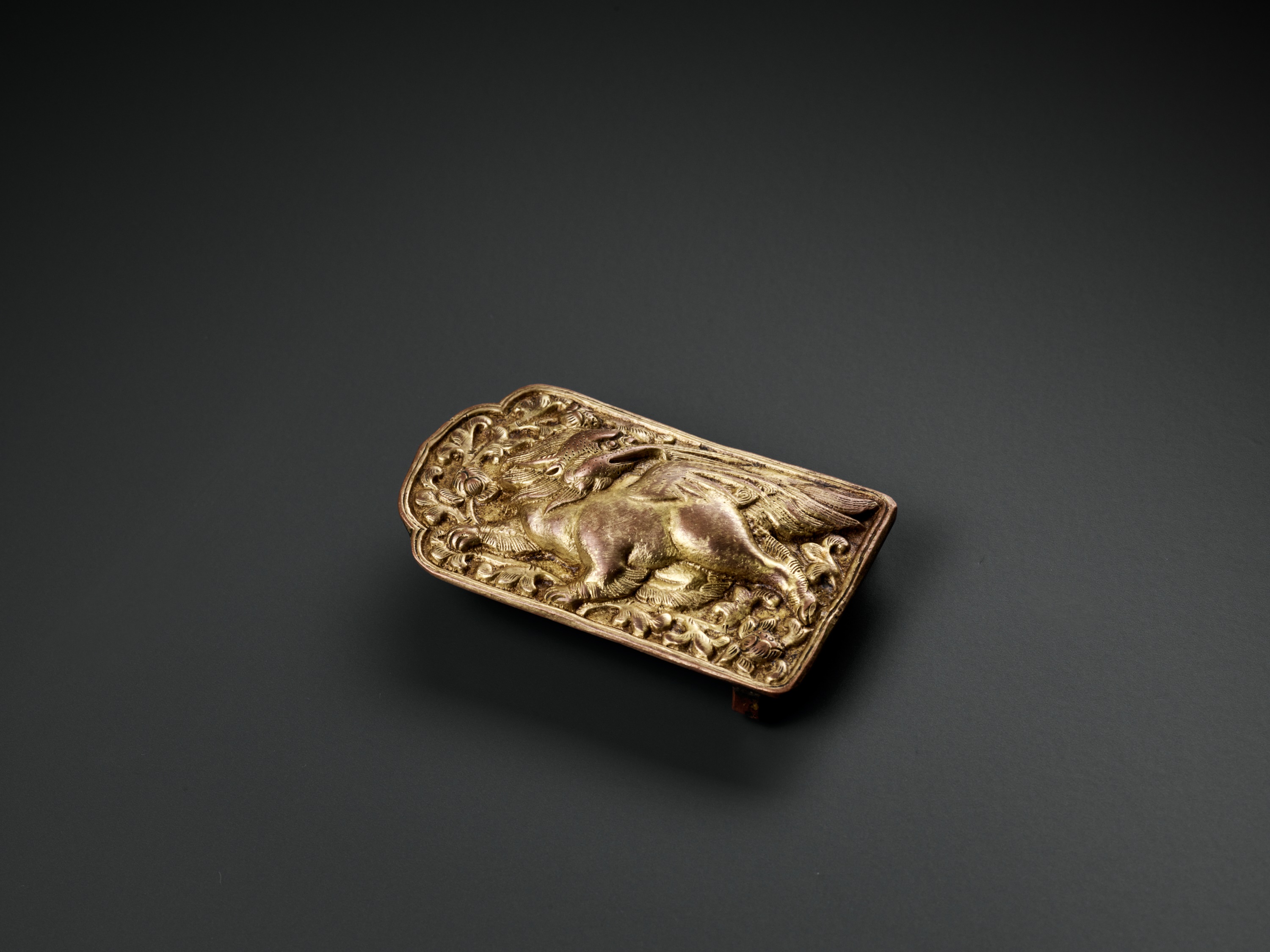 Lot 343 - A GILT COPPER ALLOY REPOUSSÉ ‘GARUDA’ BELT