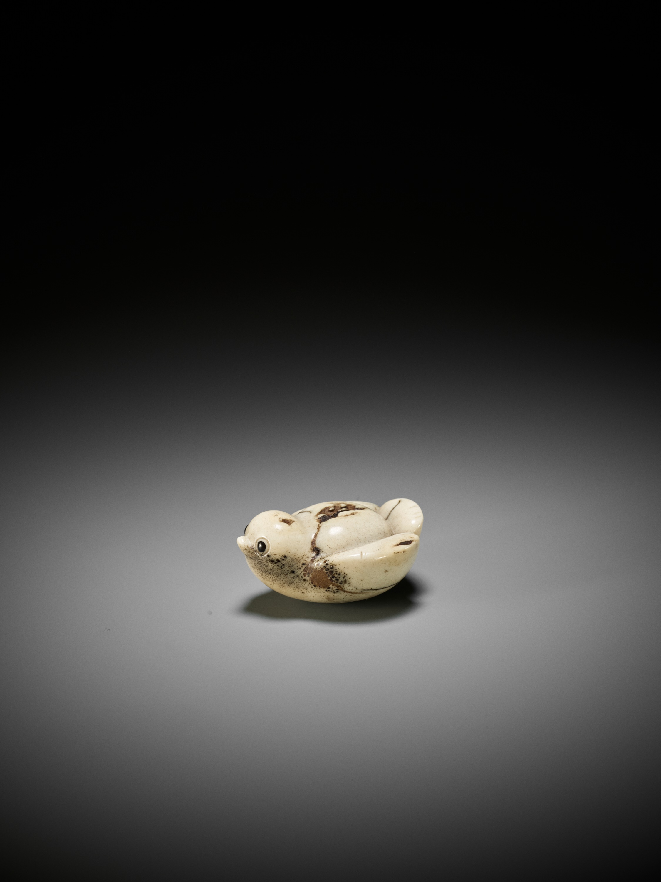 Lot 212 - MASATOSHI: A STAG ANTLER NETSUKE OF A FUKURA