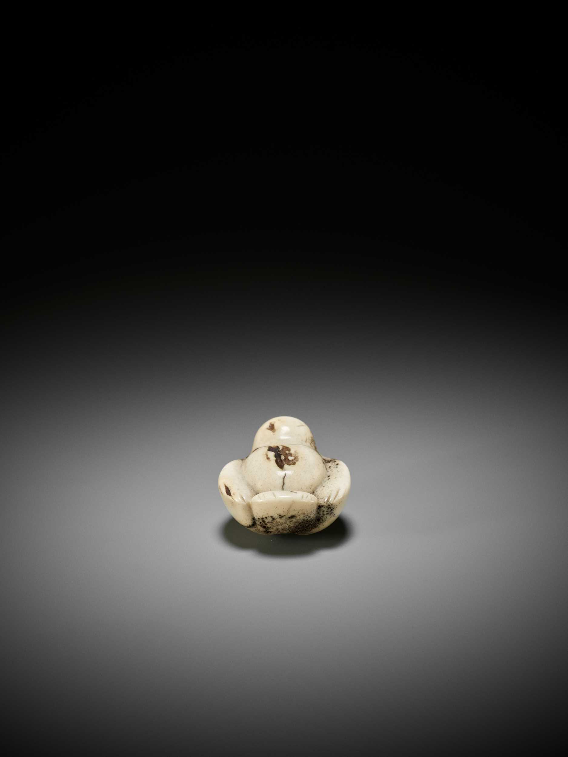 Lot 212 - MASATOSHI: A STAG ANTLER NETSUKE OF A FUKURA