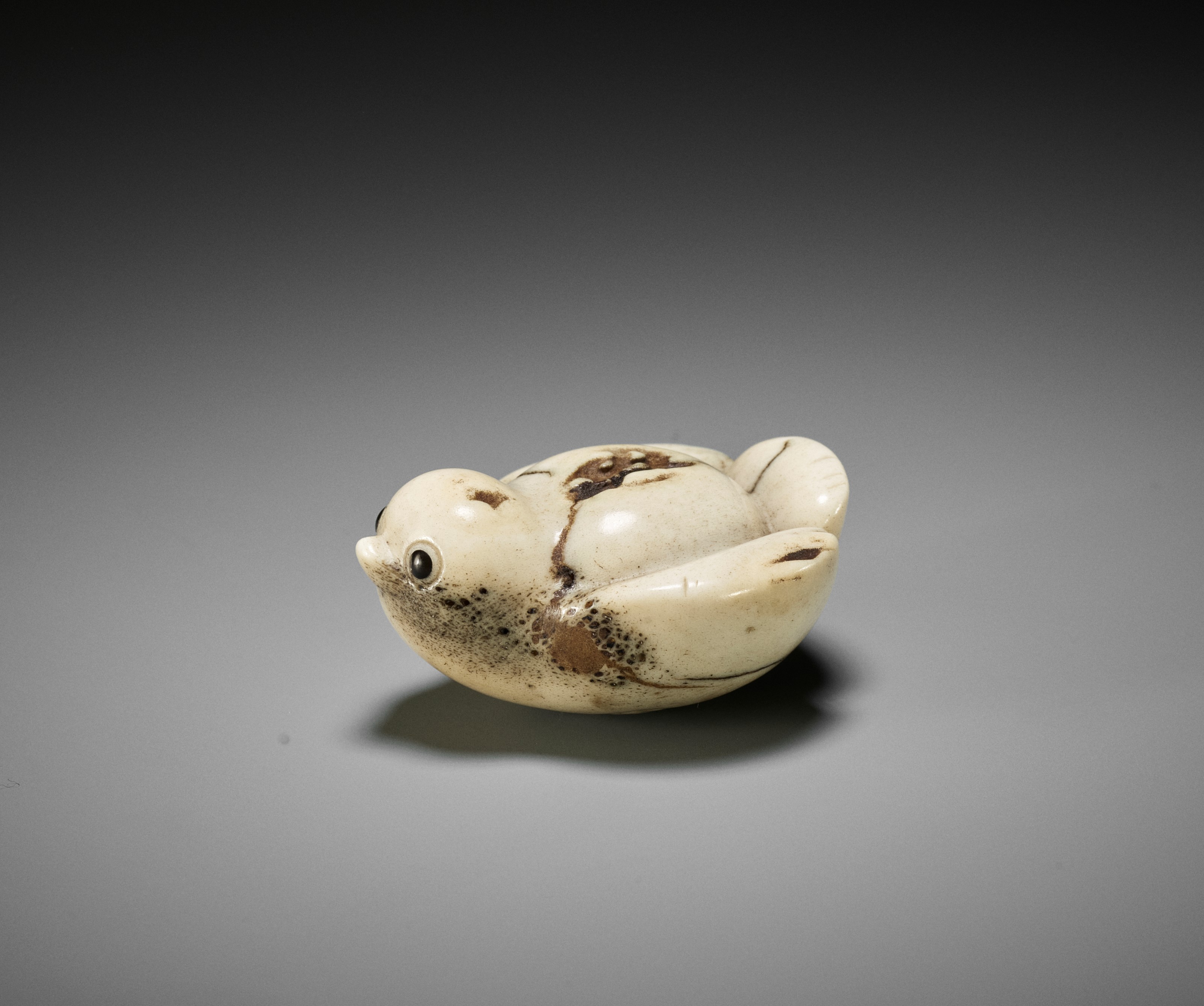 Lot 212 - MASATOSHI: A STAG ANTLER NETSUKE OF A FUKURA