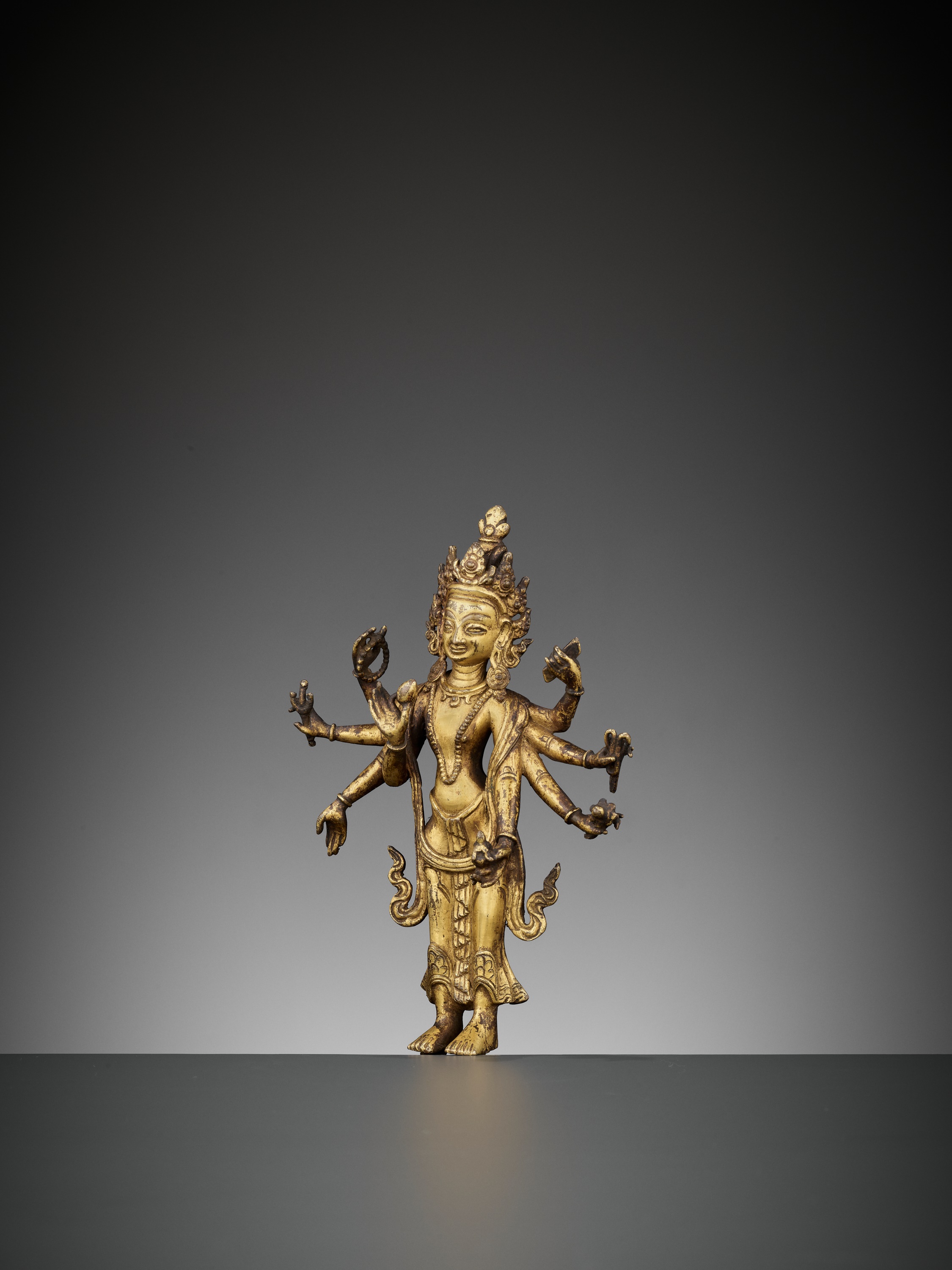 Lot 394 - A GILT COPPER FIGURE OF AMOGHAPASA,