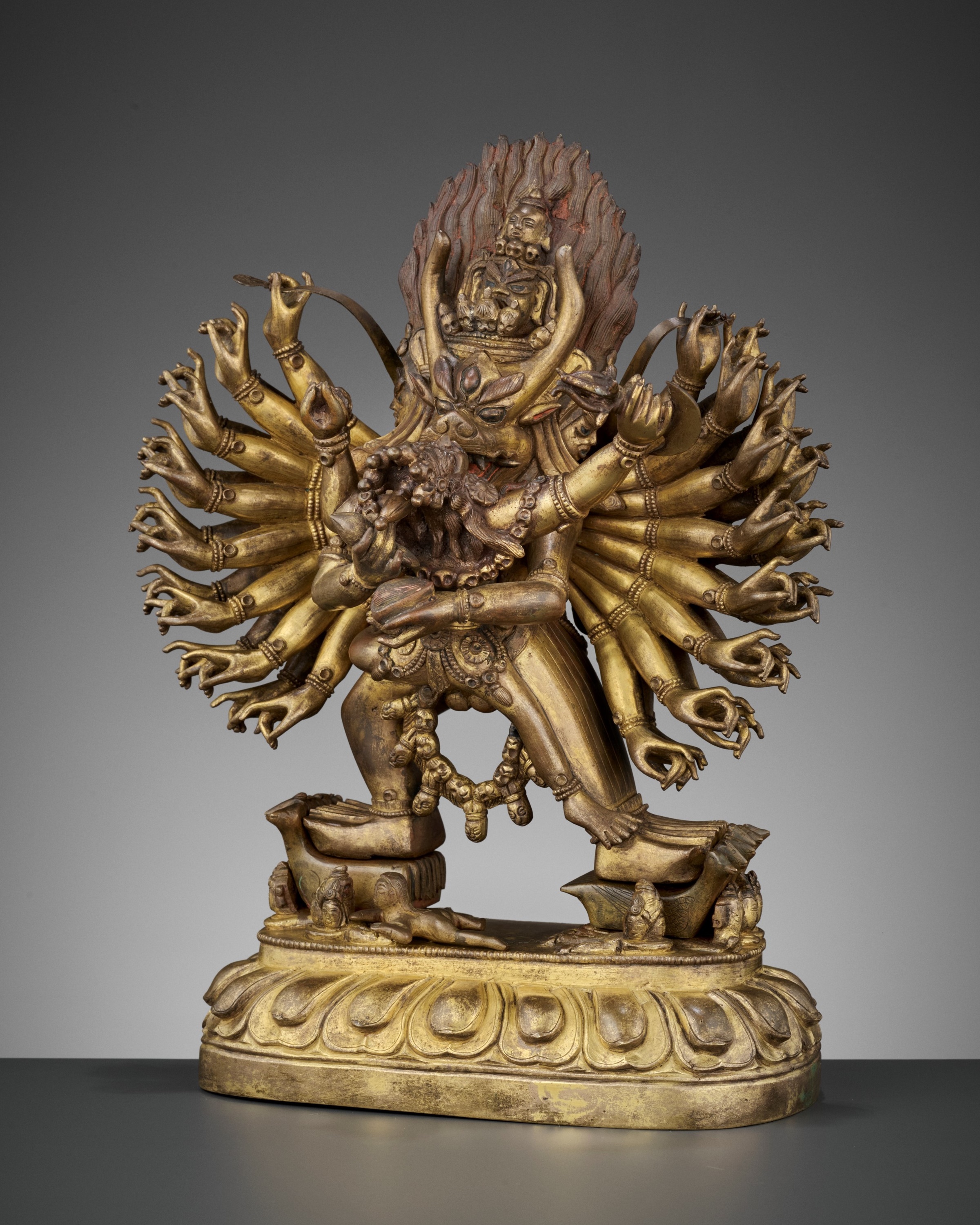 Lot 414 - A GILT BRONZE FIGURE OF VAJRABHAIRAVA AND