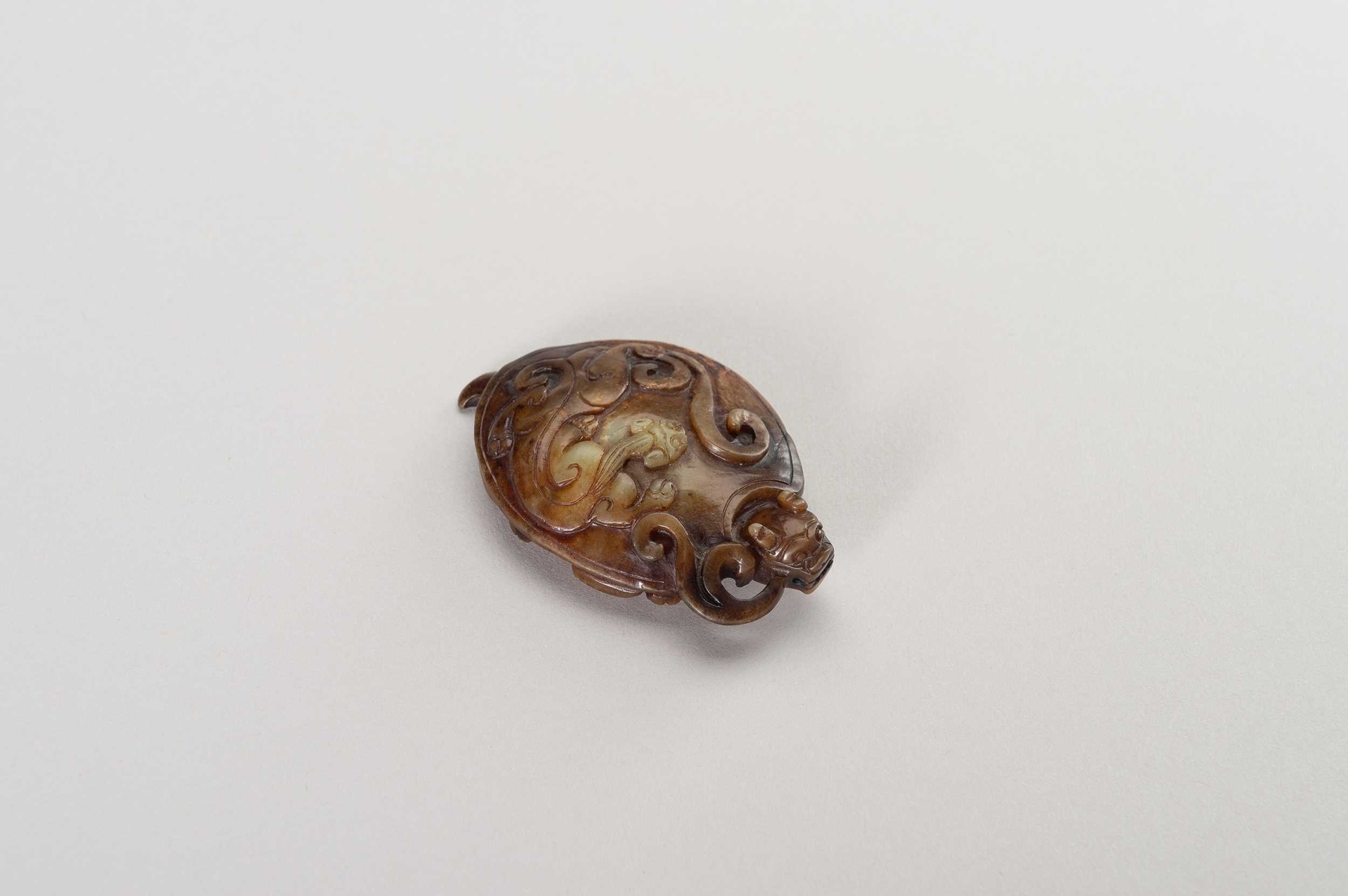 Lot 262 - A YELLOW AND RUSSET JADE FIGURE OF A BIXI