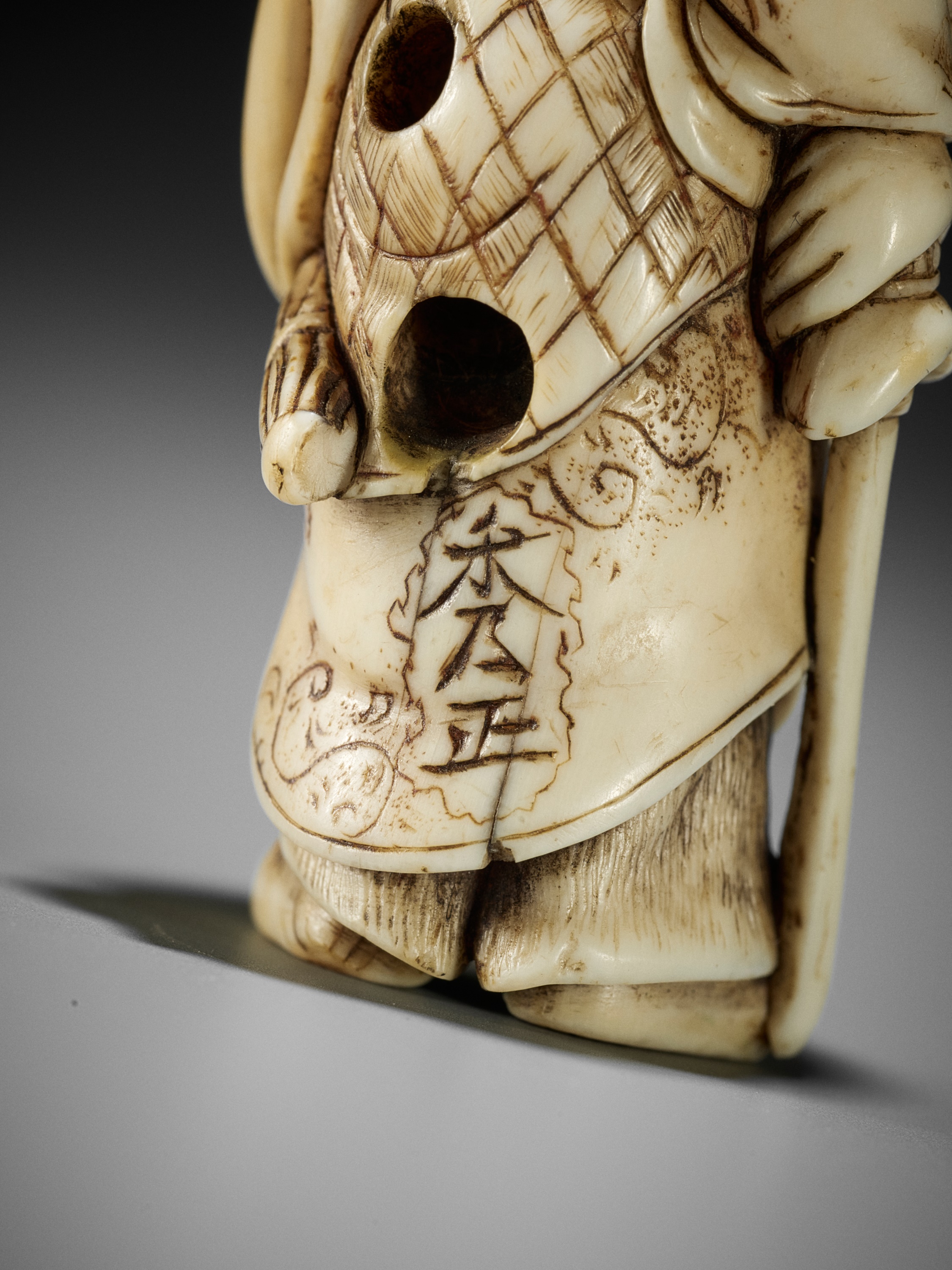 Lot 65 - HIDEMASA: A FINE IVORY NETSUKE OF SHOKI