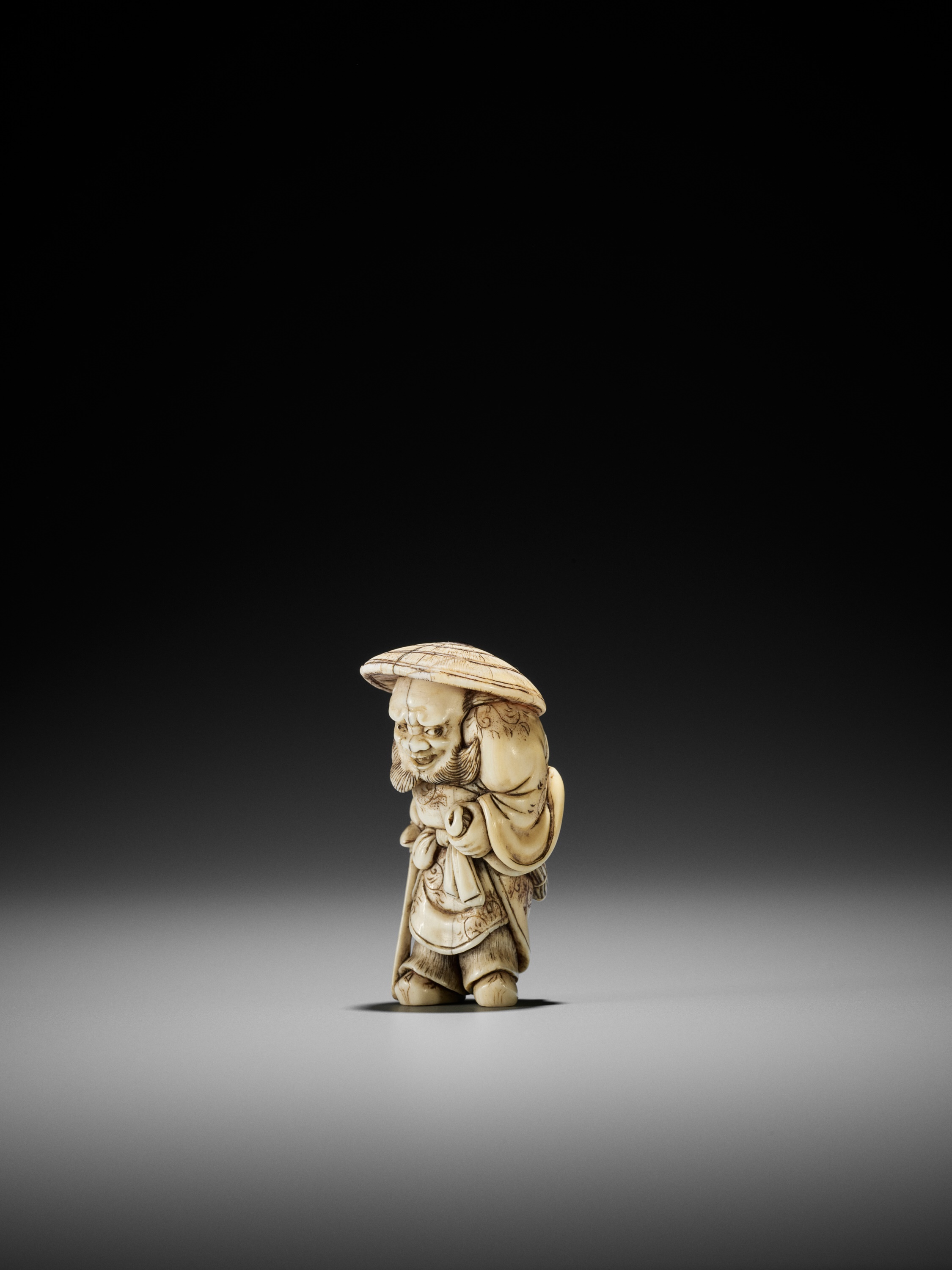 Lot 65 - HIDEMASA: A FINE IVORY NETSUKE OF SHOKI