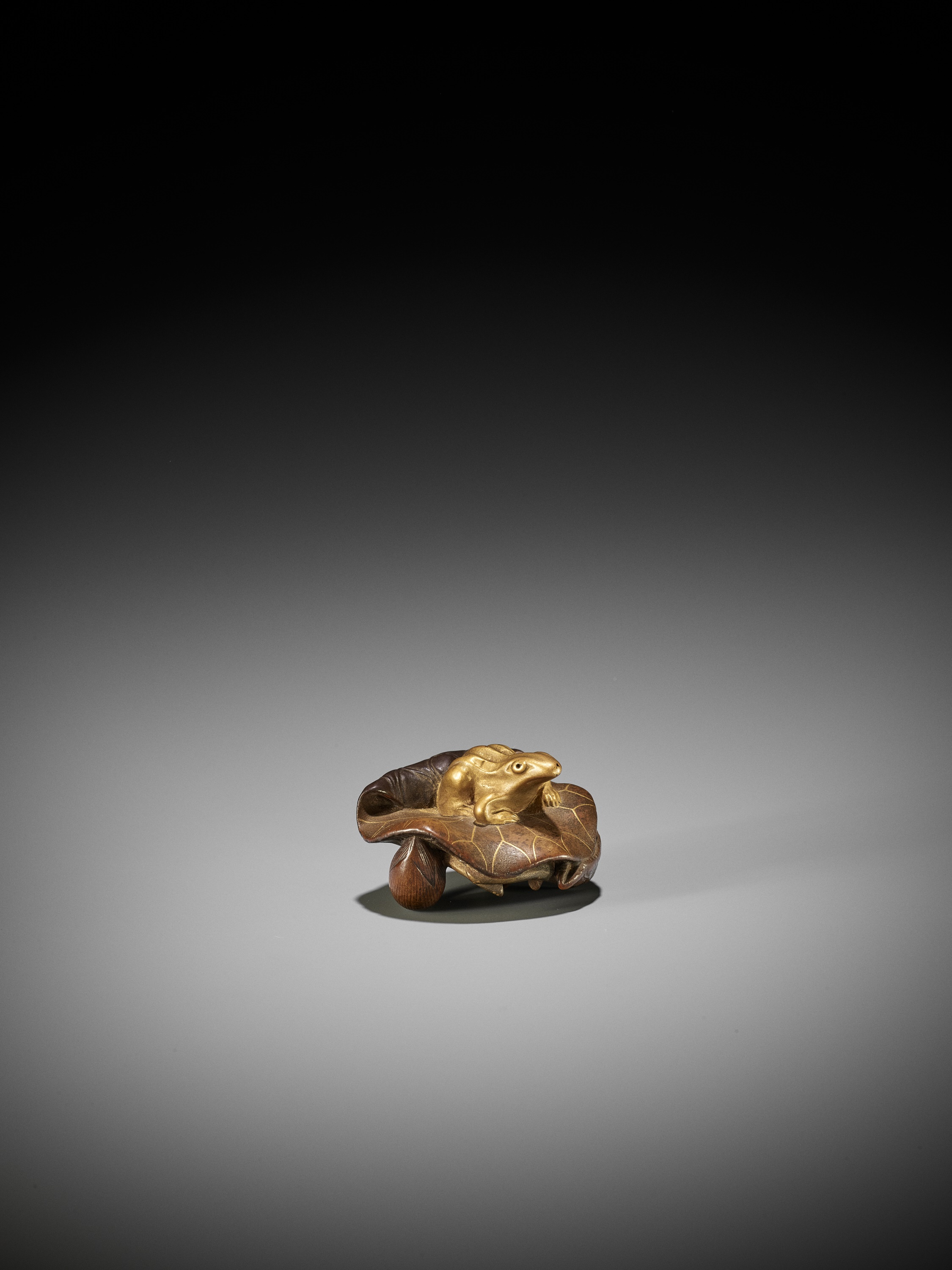 Lot 85 - TOMONOBU: A RARE LACQUERED WOOD NETSUKE OF A