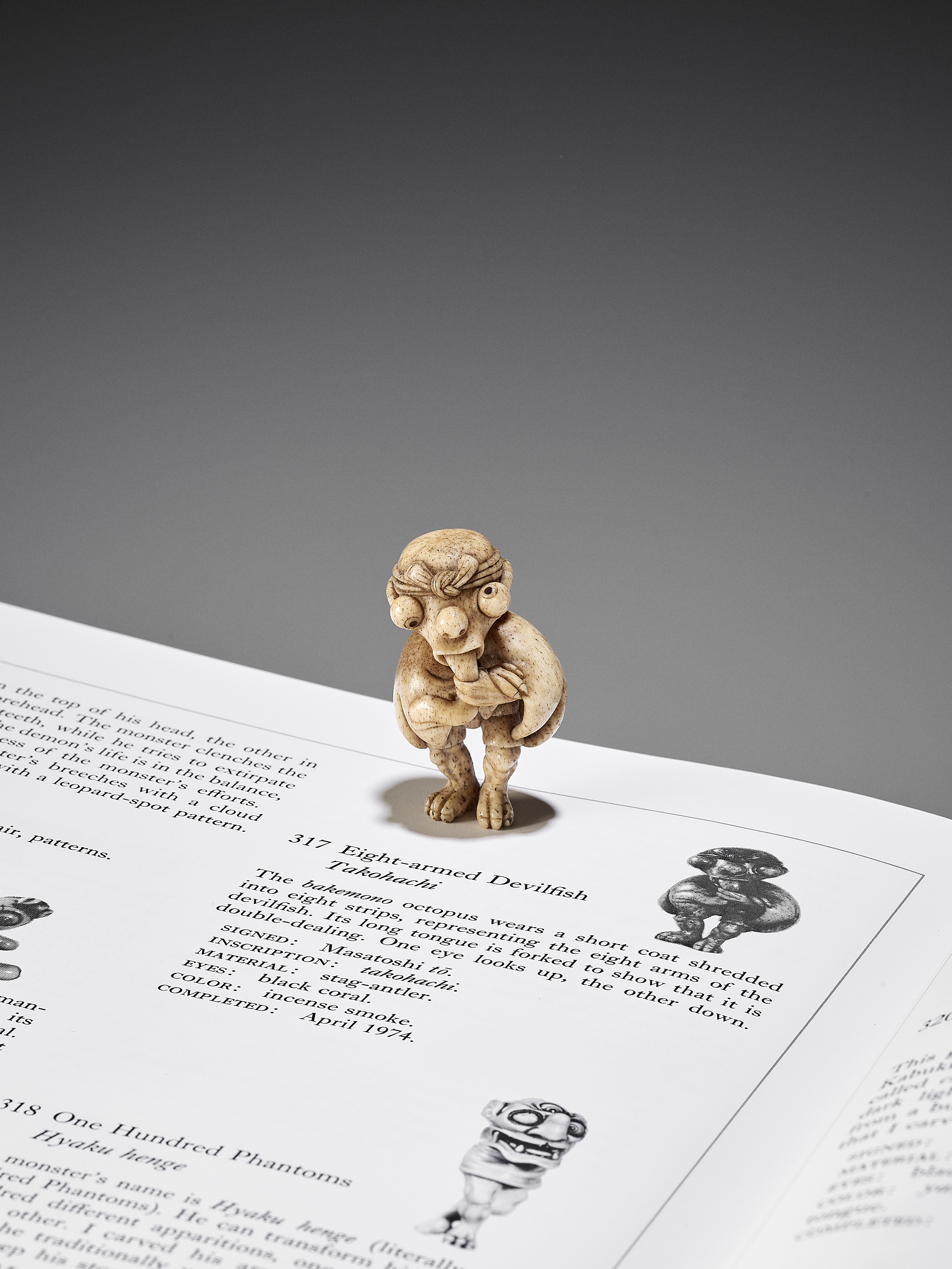 Lot 216 - MASATOSHI: A RARE STAG ANTLER NETSUKE OF AN