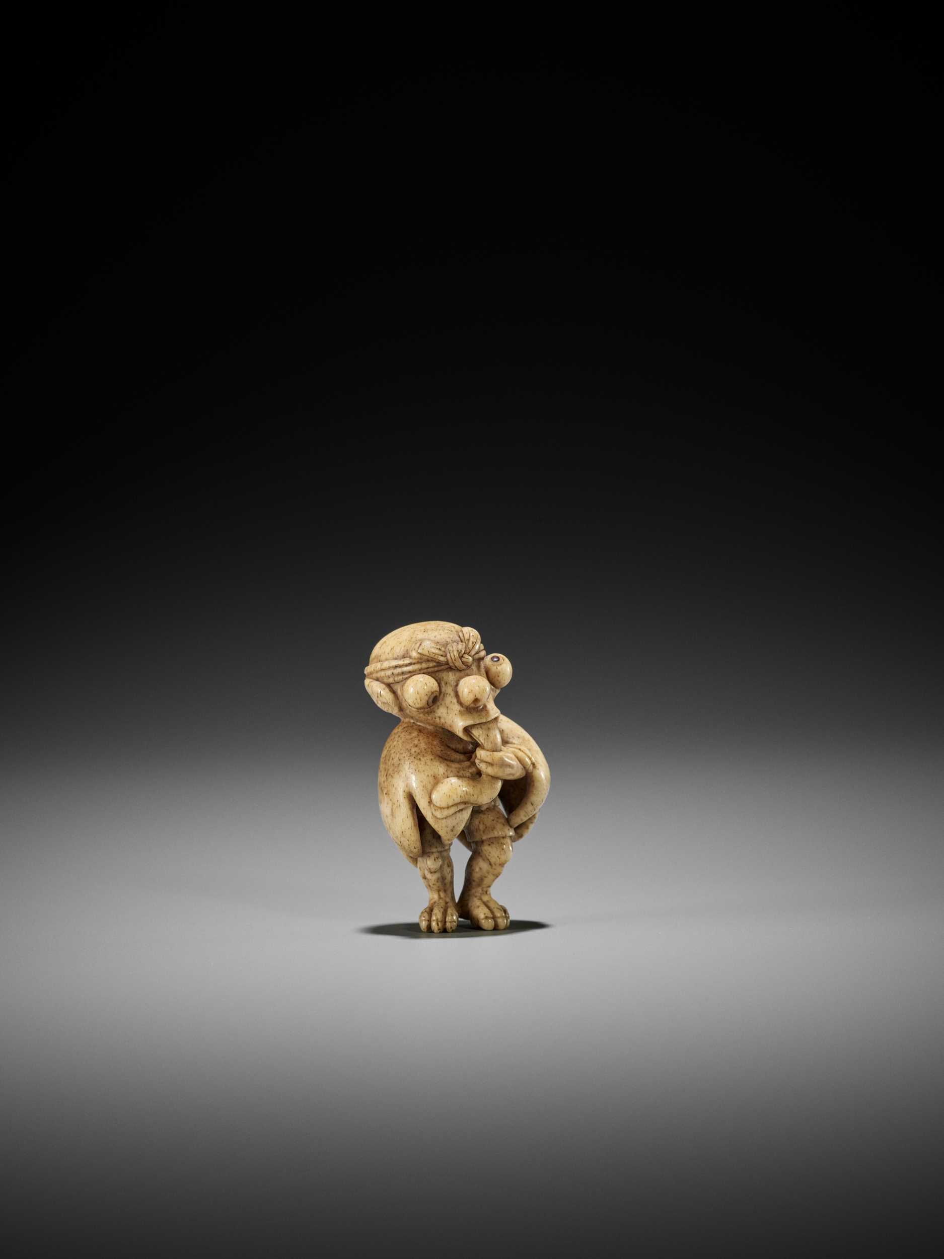 Lot 216 - MASATOSHI: A RARE STAG ANTLER NETSUKE OF AN